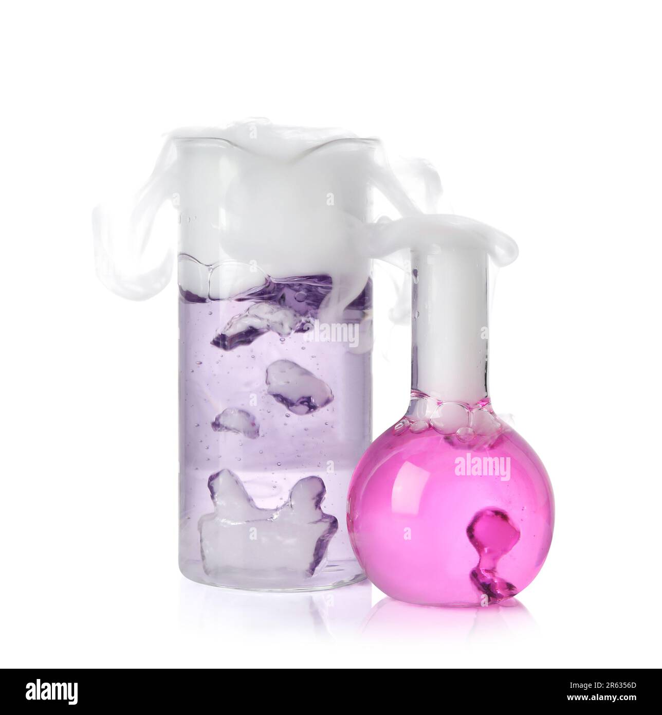 Laboratory glassware with colorful liquids and steam isolated on white ...