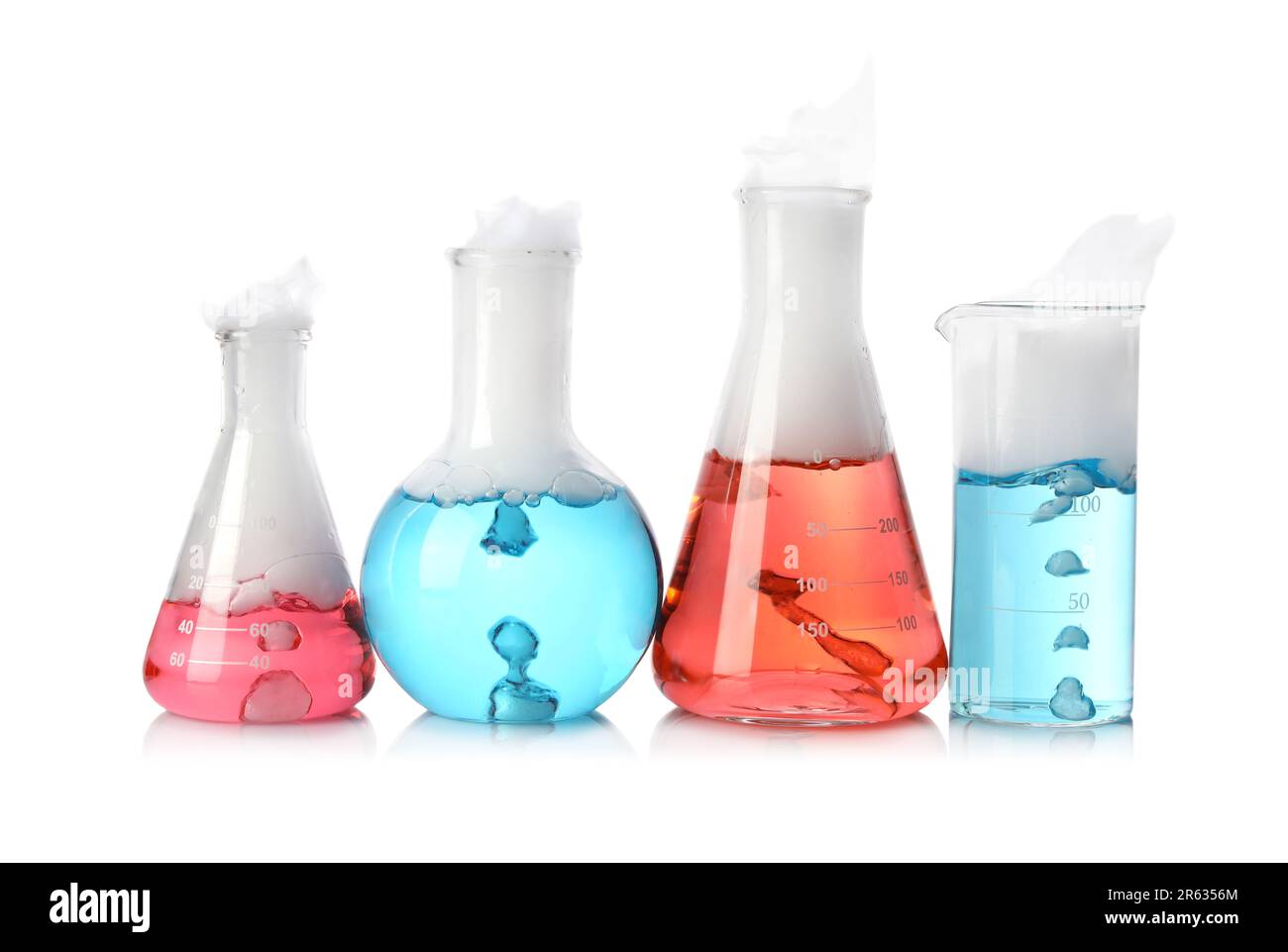 Laboratory glassware with colorful liquids and steam isolated on white ...