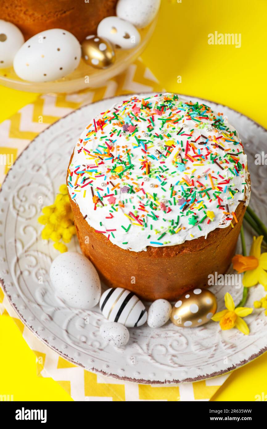 Traditional Easter cakes with sprinkles, painted eggs and beautiful ...