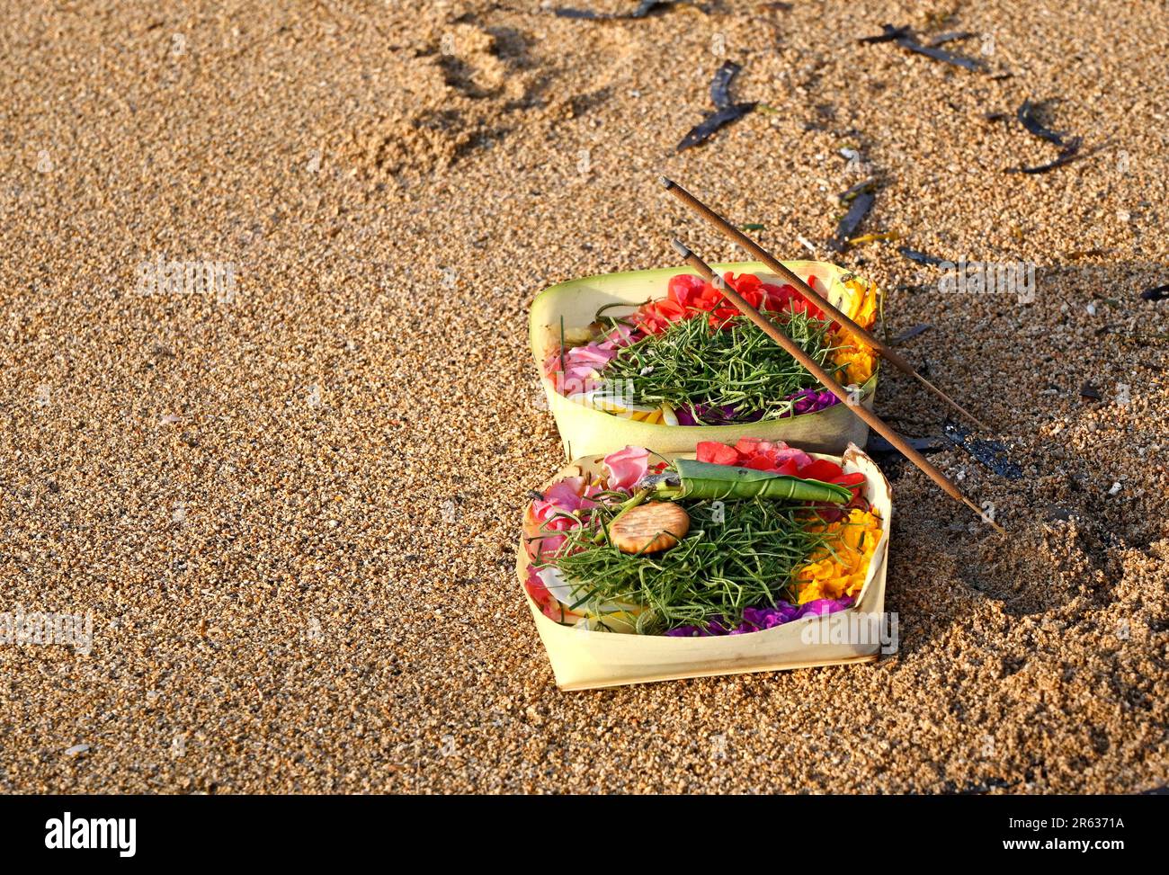 Canang Sari offering to the Hindu Gods on the beach at Sanur, Bali at ...