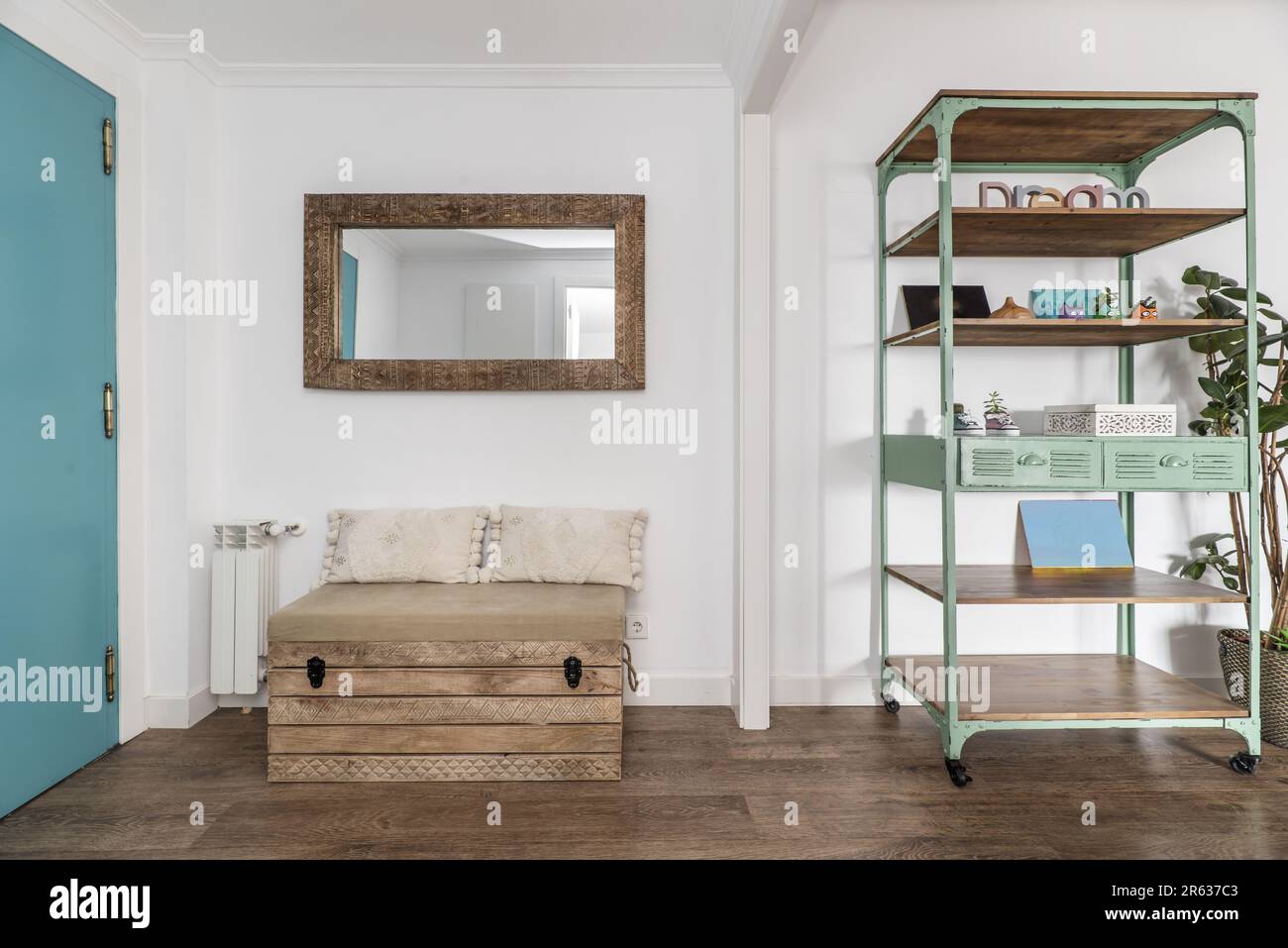 Nice hall of a house with industrial style furniture and a mirror with ...