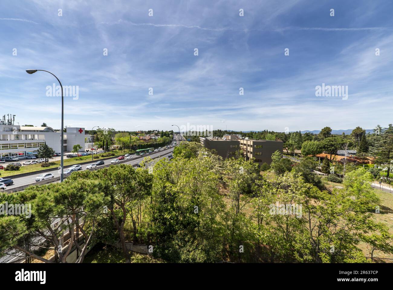 View of a curve in a road with traffic in both directions on the ...