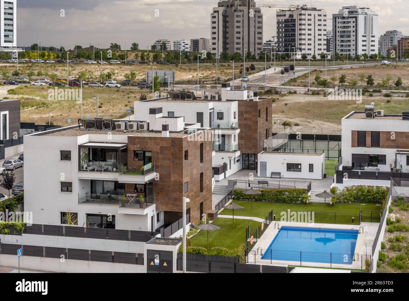 Facades of low-rise residential buildings with a community pool Stock ...