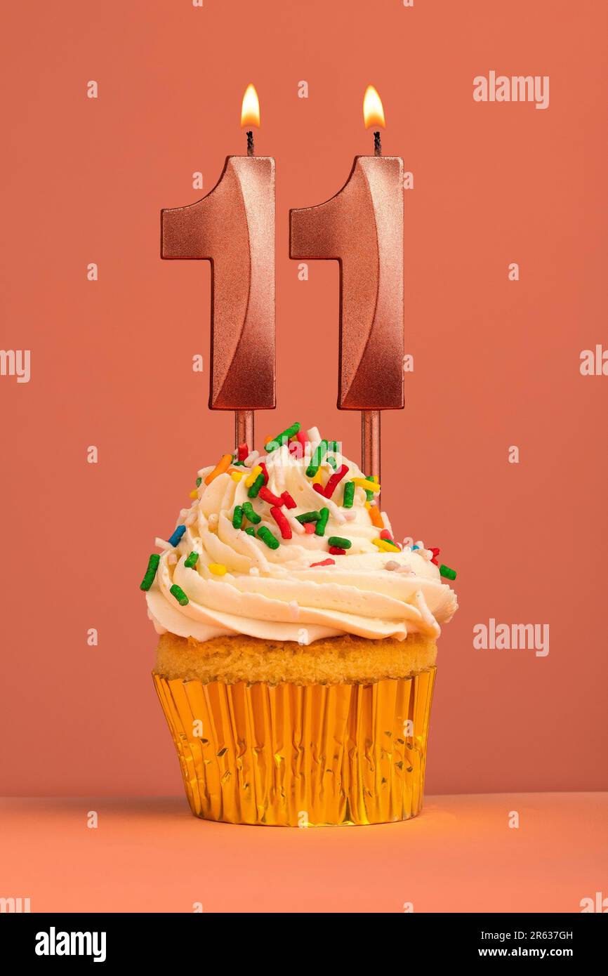 Birthday cake with candle number 11 - Coral fusion background Stock ...