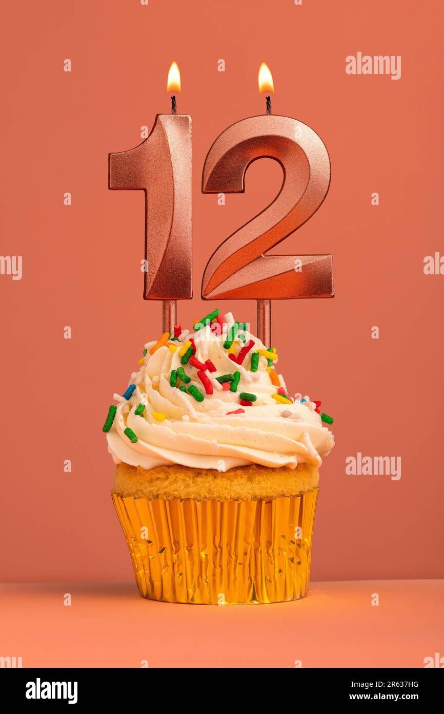 Candle number 12 - Cake birthday in coral fusion background Stock Photo ...