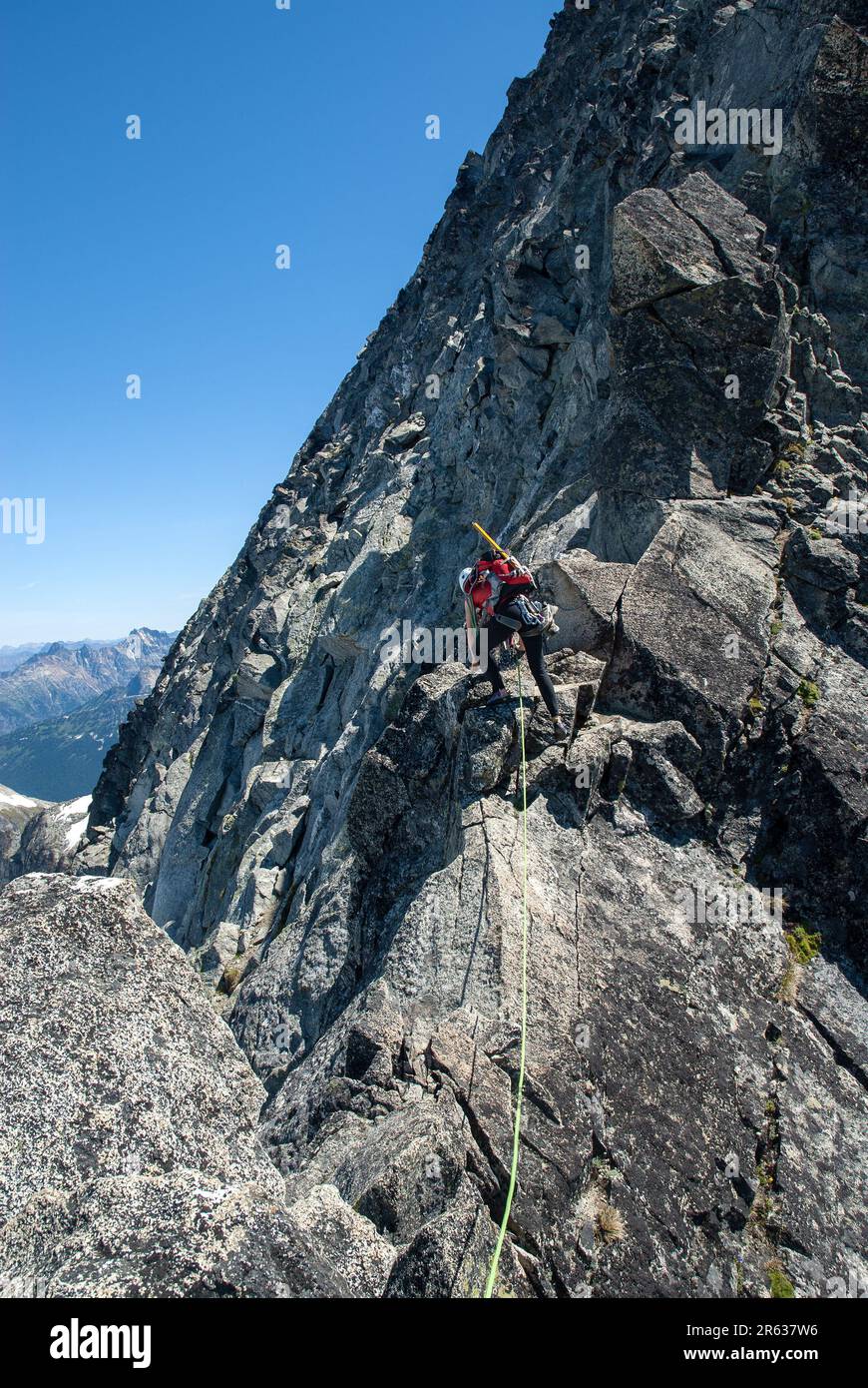 Female woman climber ascending Forbidden Peak. North Cascades ...
