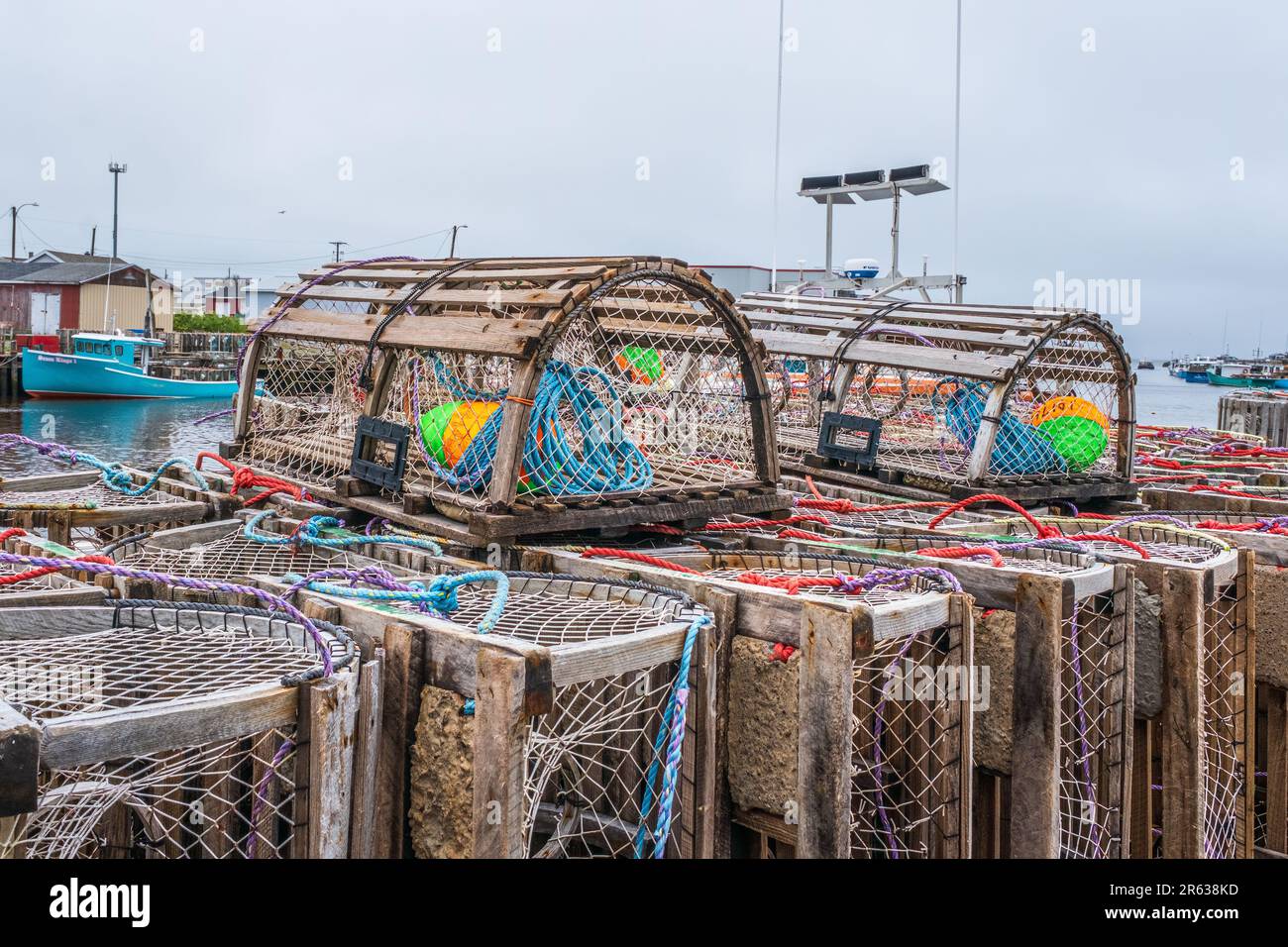 Lobster traps are assembled on the wharf in Glace Bay Nova Scotia ready ...