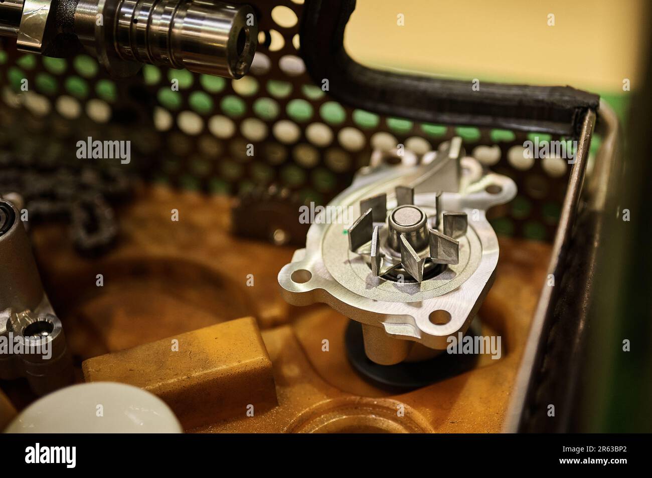 Various parts for assembly during the assembly of an automobile engine ...