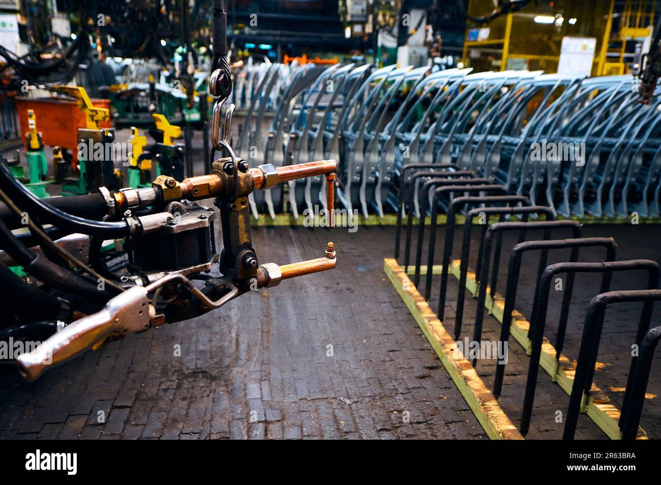 Machine with welding gun for spot weld in plant workshop Stock Photo ...