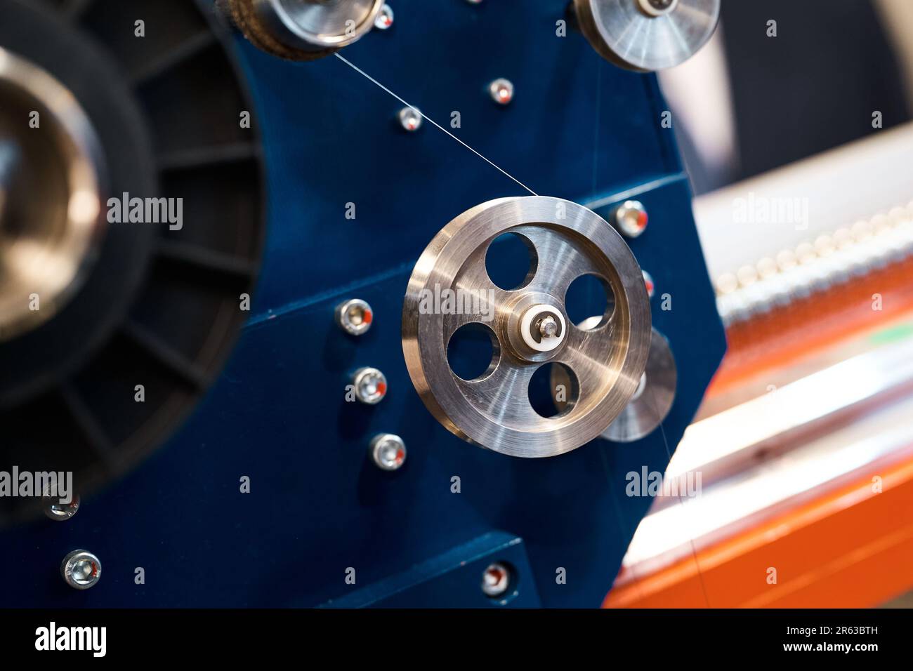 Wire feeding mechanism of electroerosive machine tool Stock Photo - Alamy