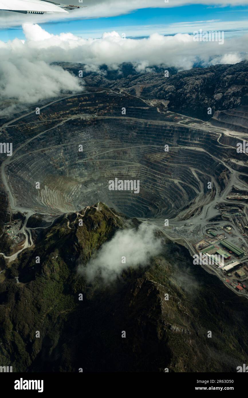 The massive Grasberg open pit mine from an airial view Stock Photo - Alamy