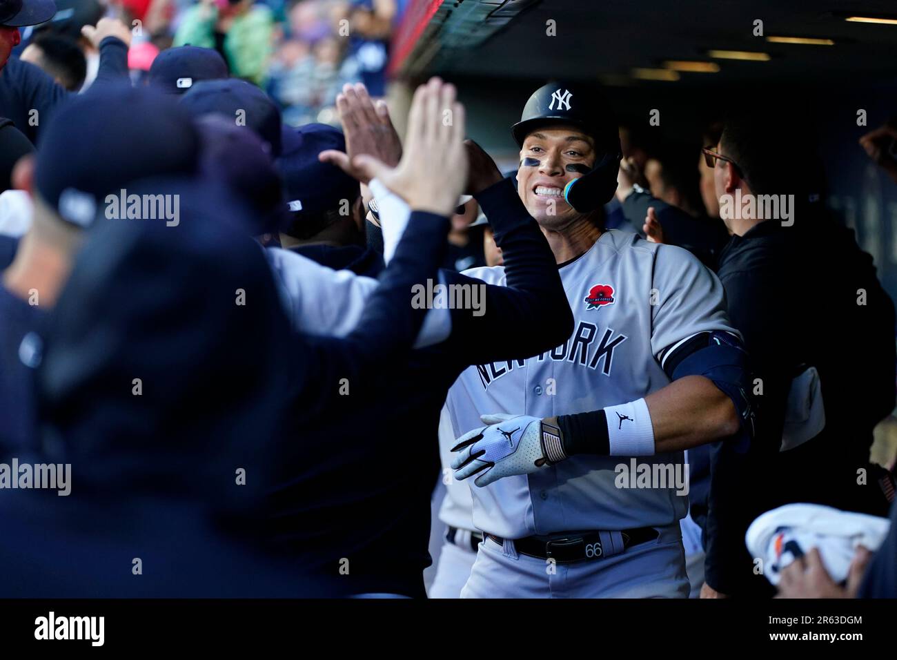 New York Yankees' Aaron Judge is greeted in the dugout after hitting a ...