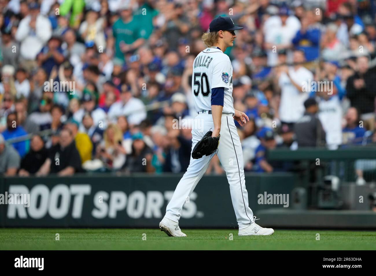 Seattle Mariners starting pitcher Bryce Miller walks off the field ...