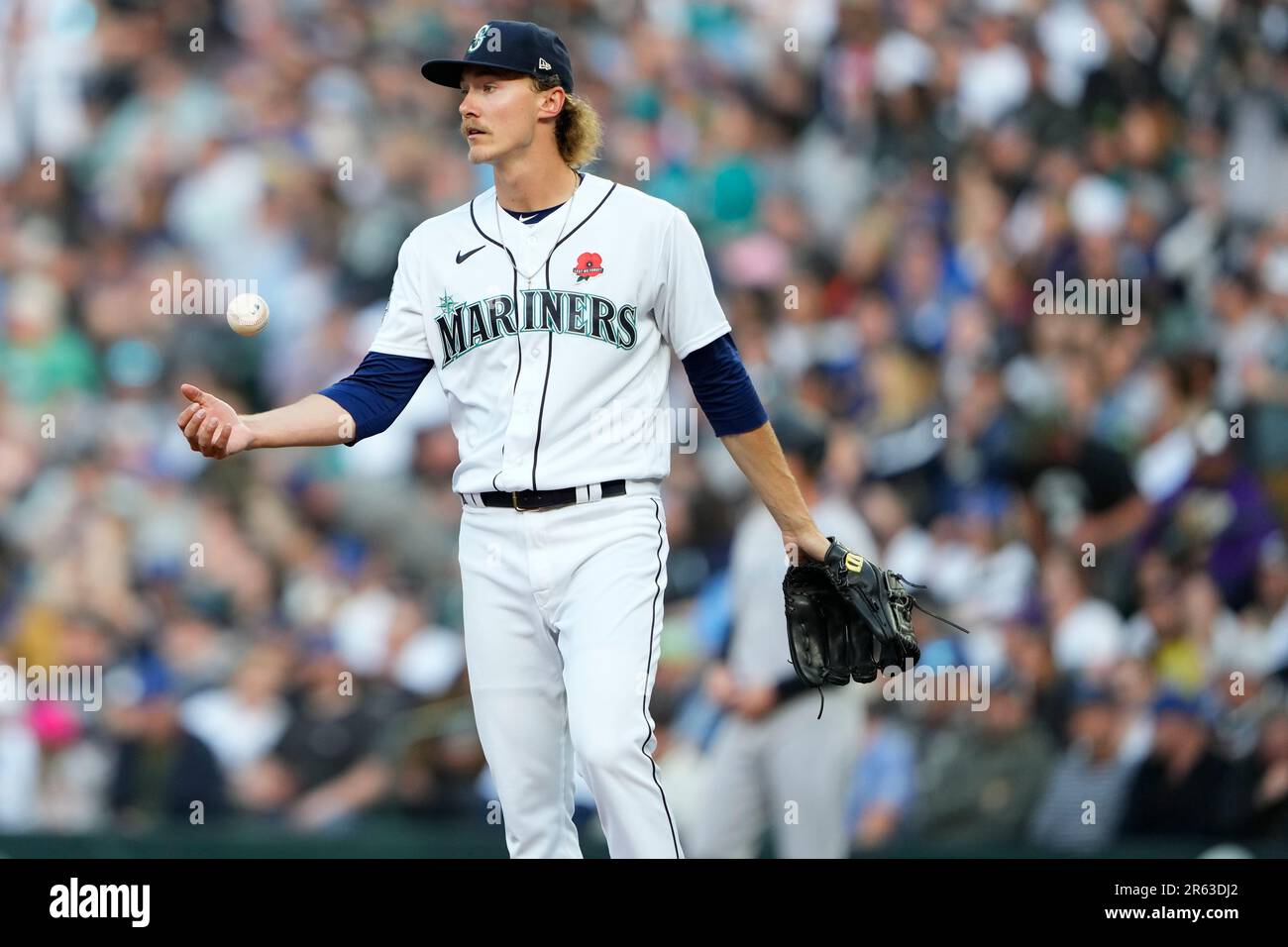 Seattle Mariners starting pitcher Bryce Miller reacts after giving up a ...