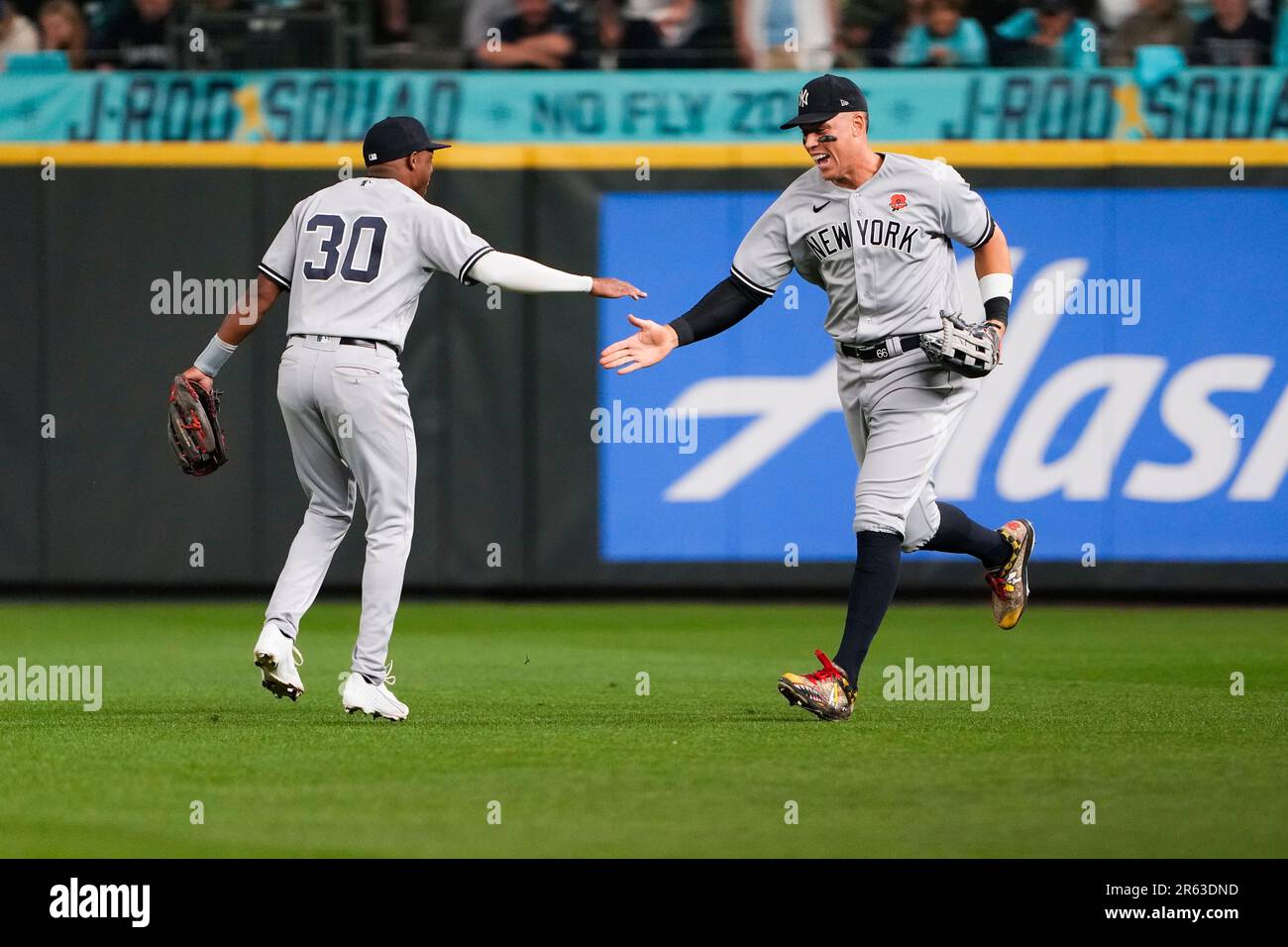 New York Yankees center fielder Greg Allen greets right fielder Aaron Judge after Judge made a ...