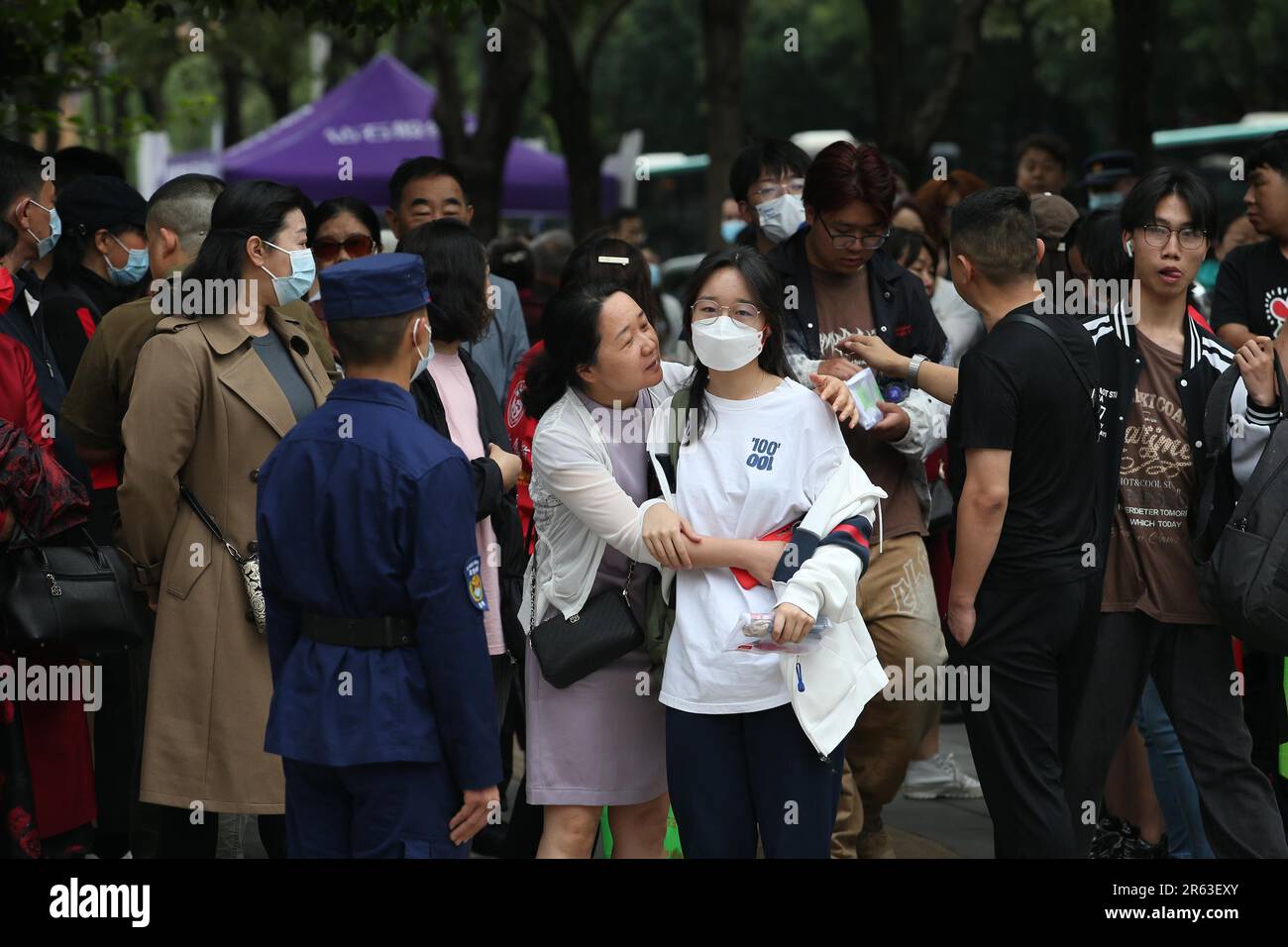 Candidates wait outside of the examination hall for the 2023 National ...