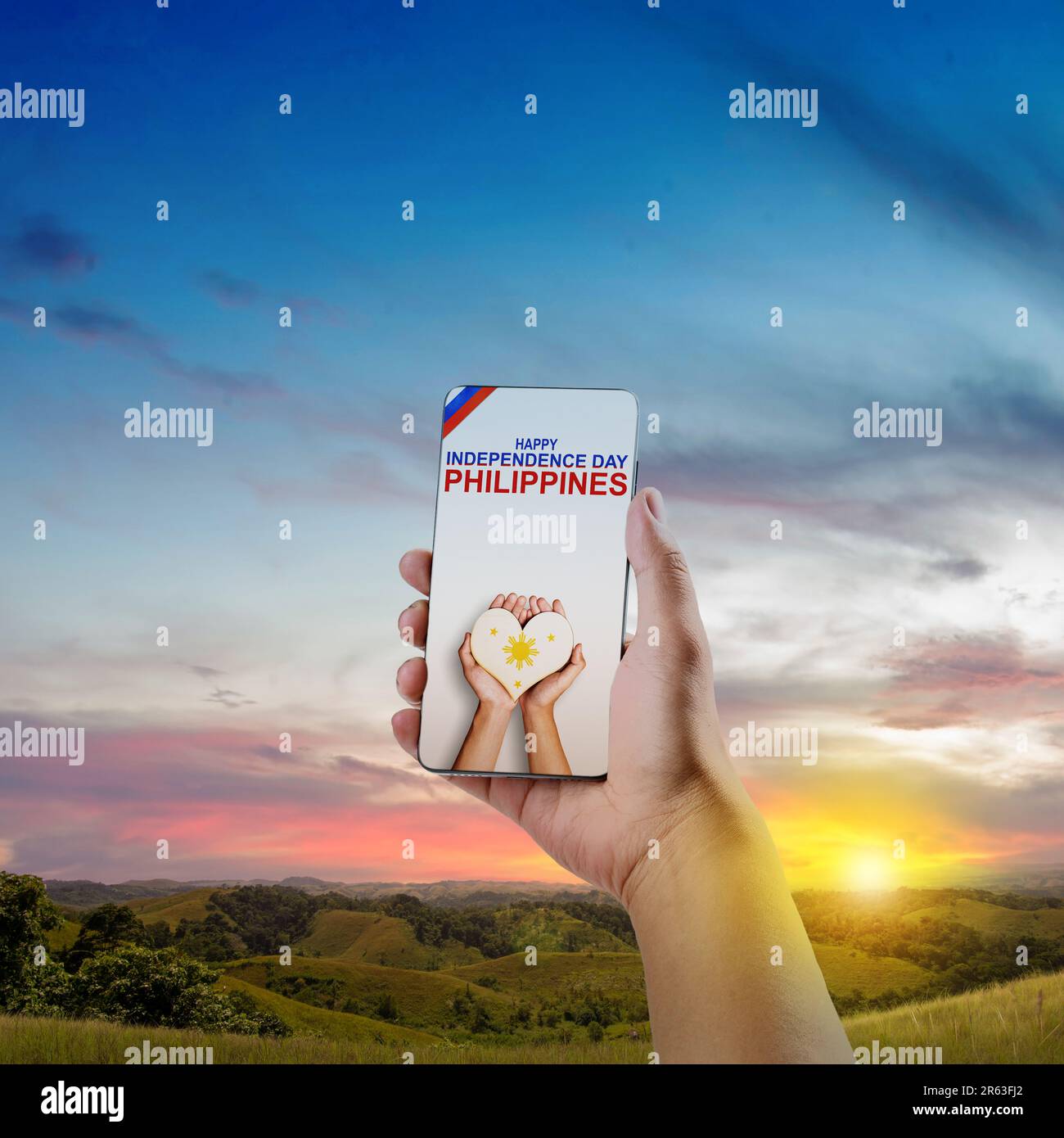 A human hand is holding a heart with the Philippine flag color ...