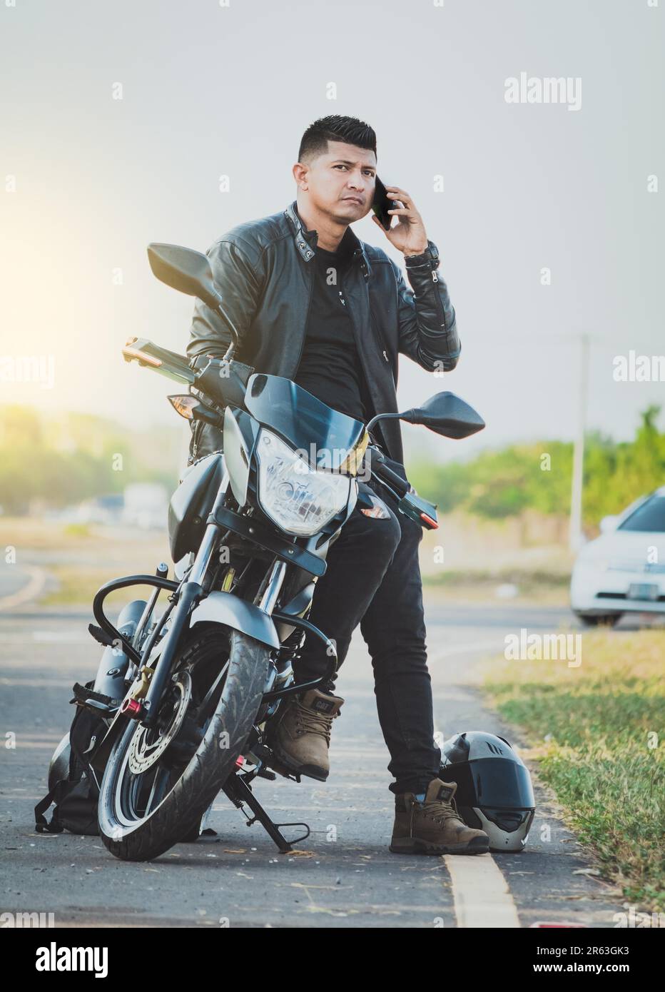 Handsome biker looking camera hi-res stock photography and images - Alamy