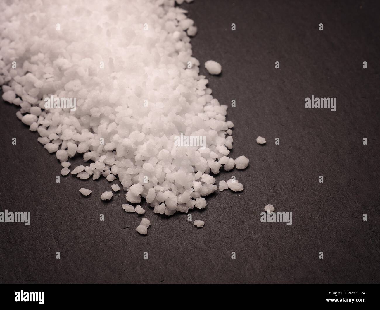 Organic salt on a dark slate board, food concepts Stock Photo - Alamy
