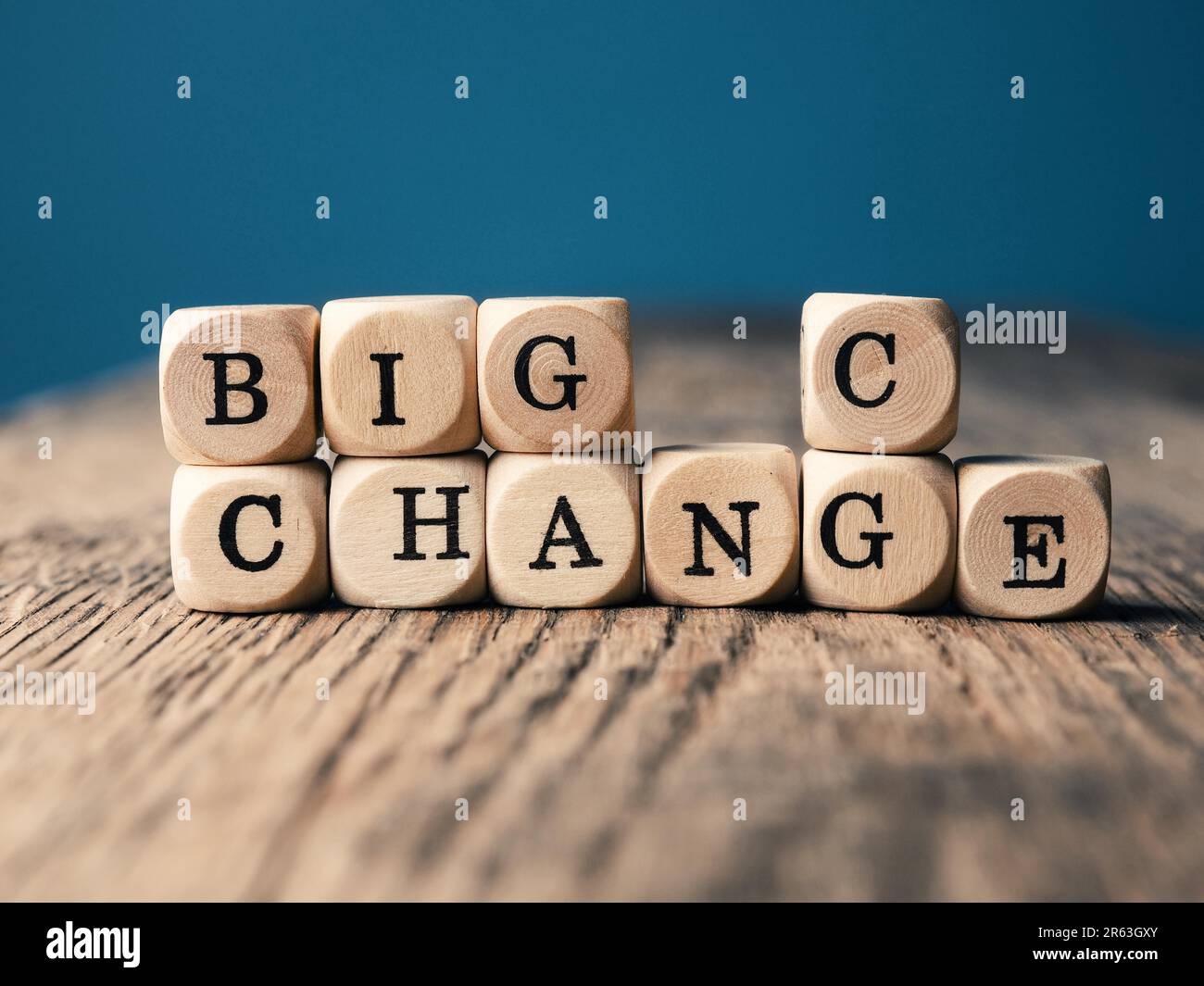 Small wooden dices with the words Big Change and Chance on an office ...