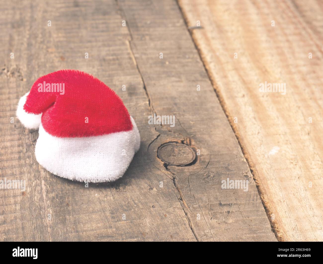 Hat of Santa on a rustic wooden plank with space for text Stock Photo ...