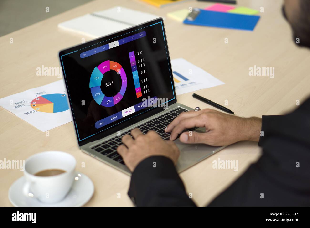 Analyst working with business analytics and data management system on ...