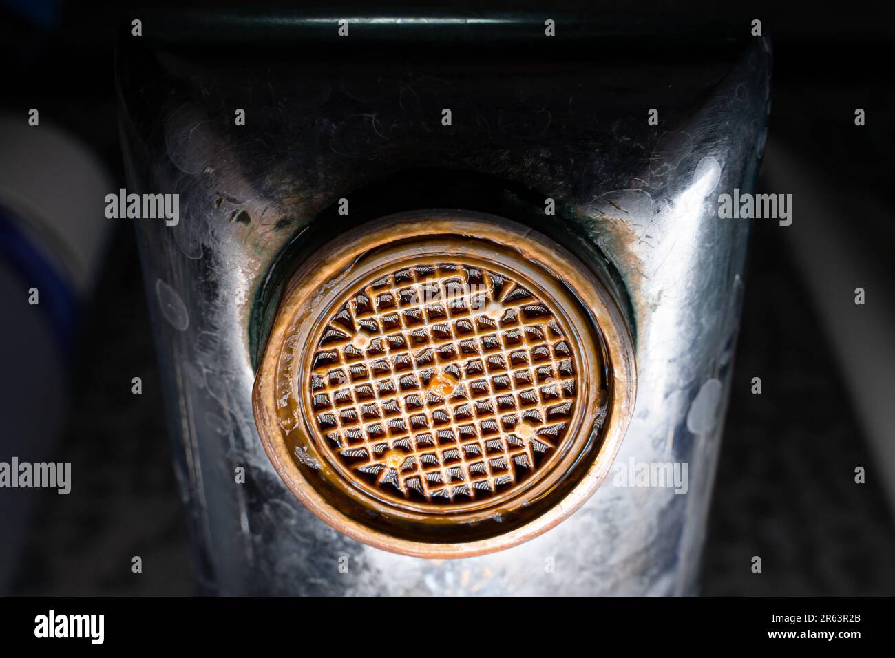 The diffuser in the faucet is clogged and corroded close-up. Old ...