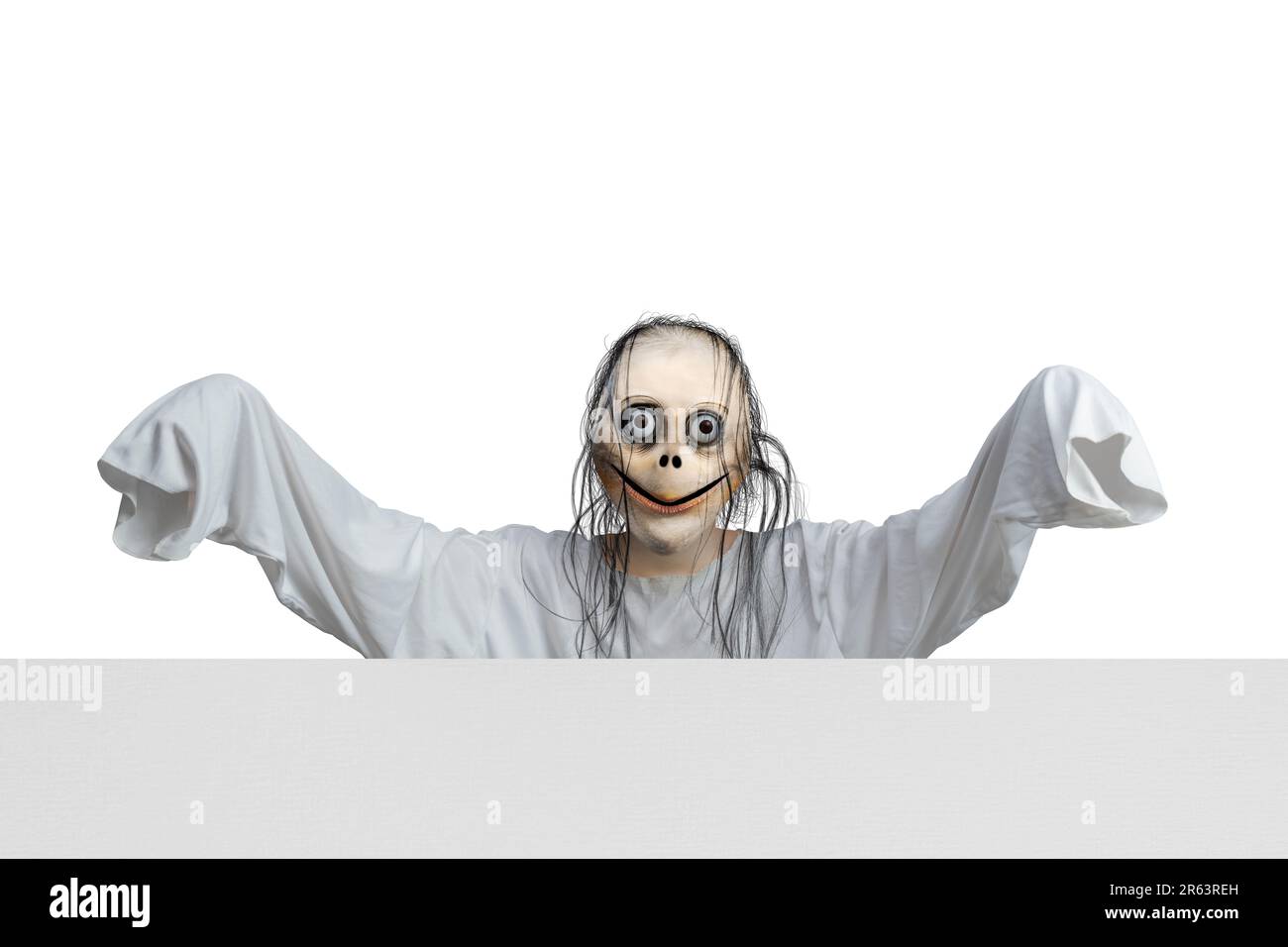 Scary Momo standing behind the wall on white background. Scary face for ...