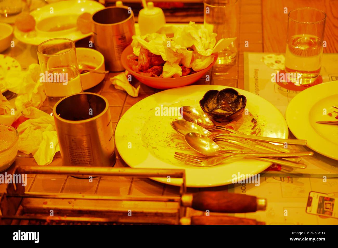 A dining table after a dinner in warm light, close up shots Stock Photo ...