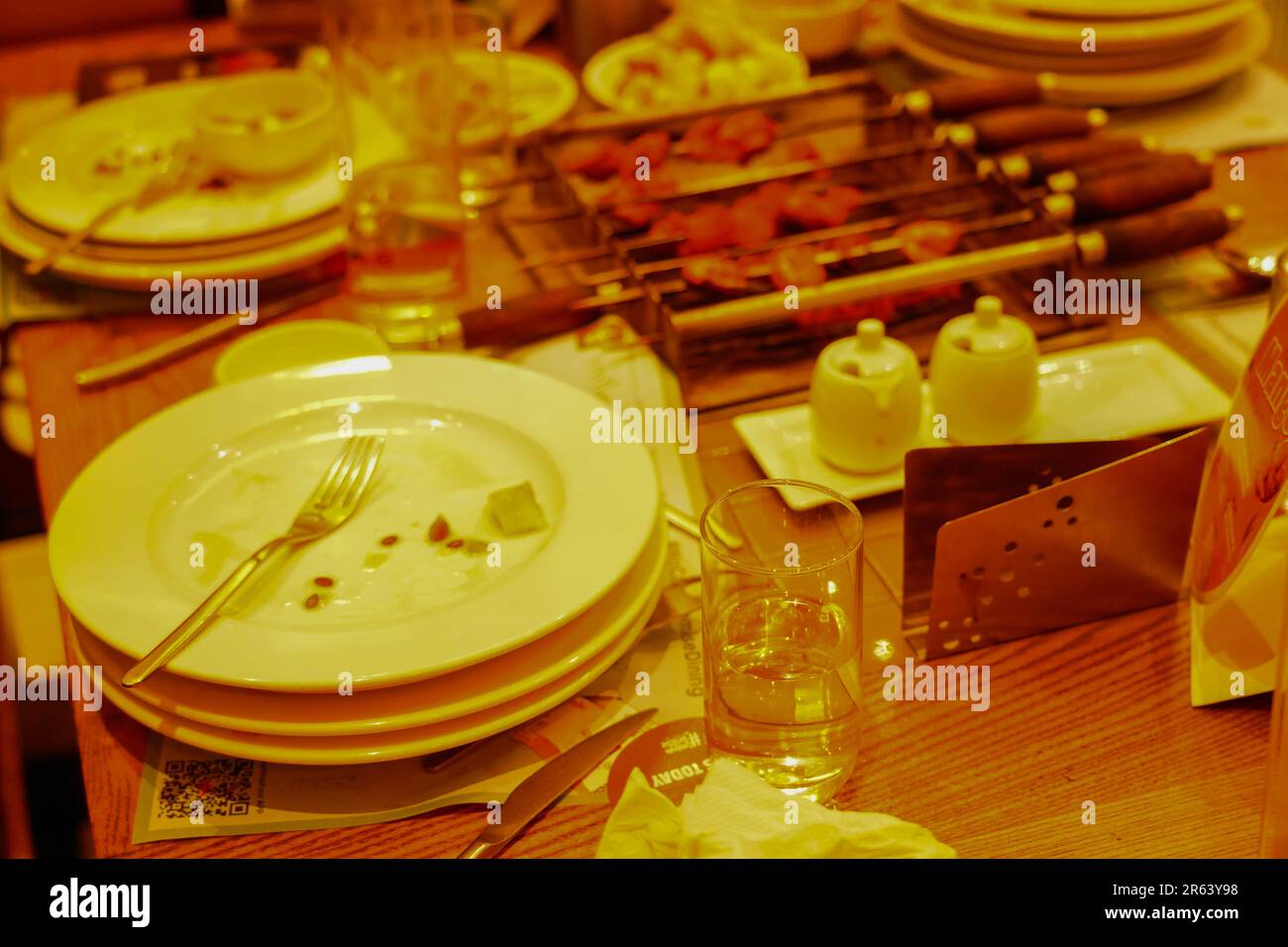 A dining table after a dinner in warm light, close up shots Stock Photo ...