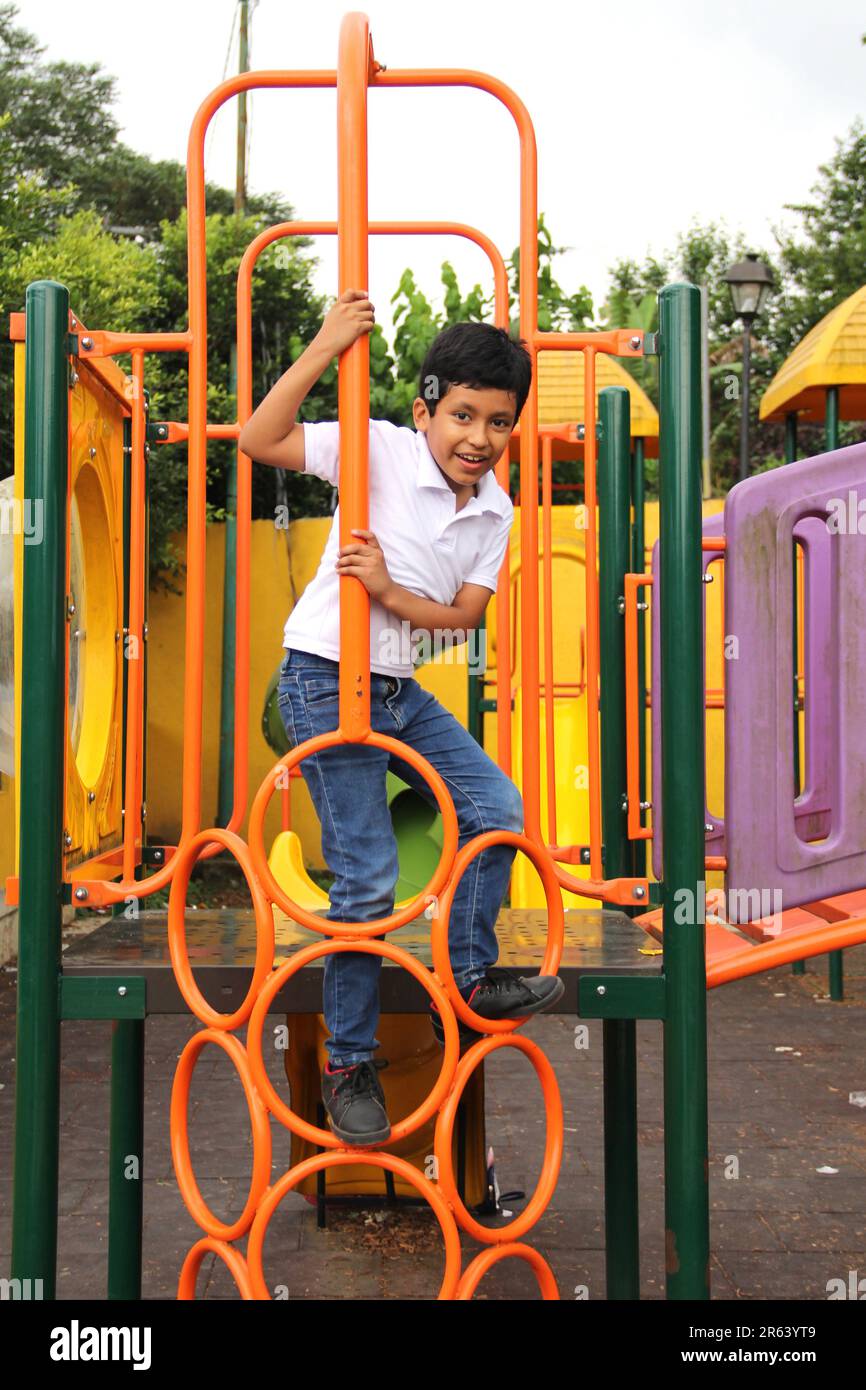 9-year-old Latino brown child boy plays in the park games lives in ...