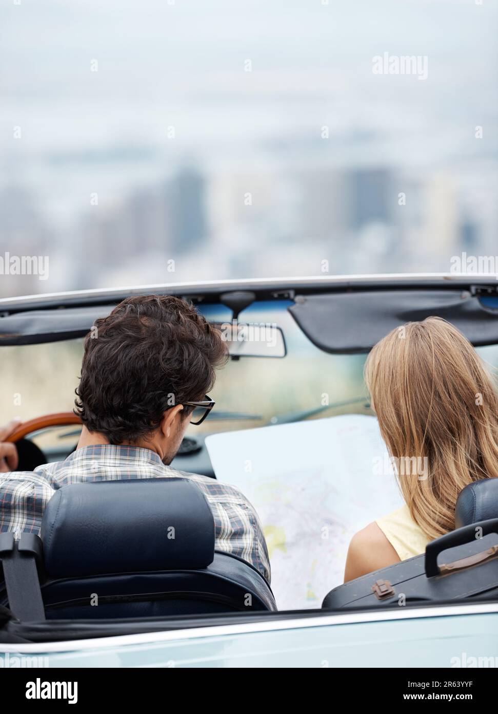 I think we should go this way next...Rear view of a young couple in ...