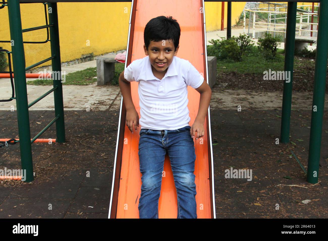 9-year-old Latino brown child boy plays in the park games lives in ...