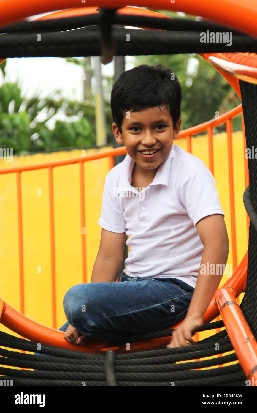 9-year-old Latino brown child boy plays in the park games lives in ...