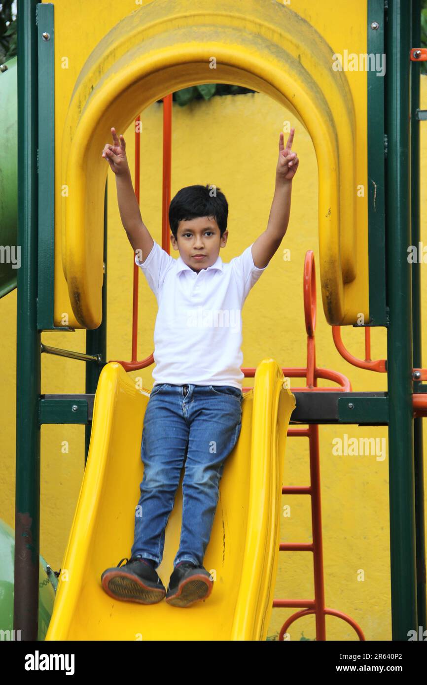9-year-old Latino brown child boy plays in the park games lives in ...
