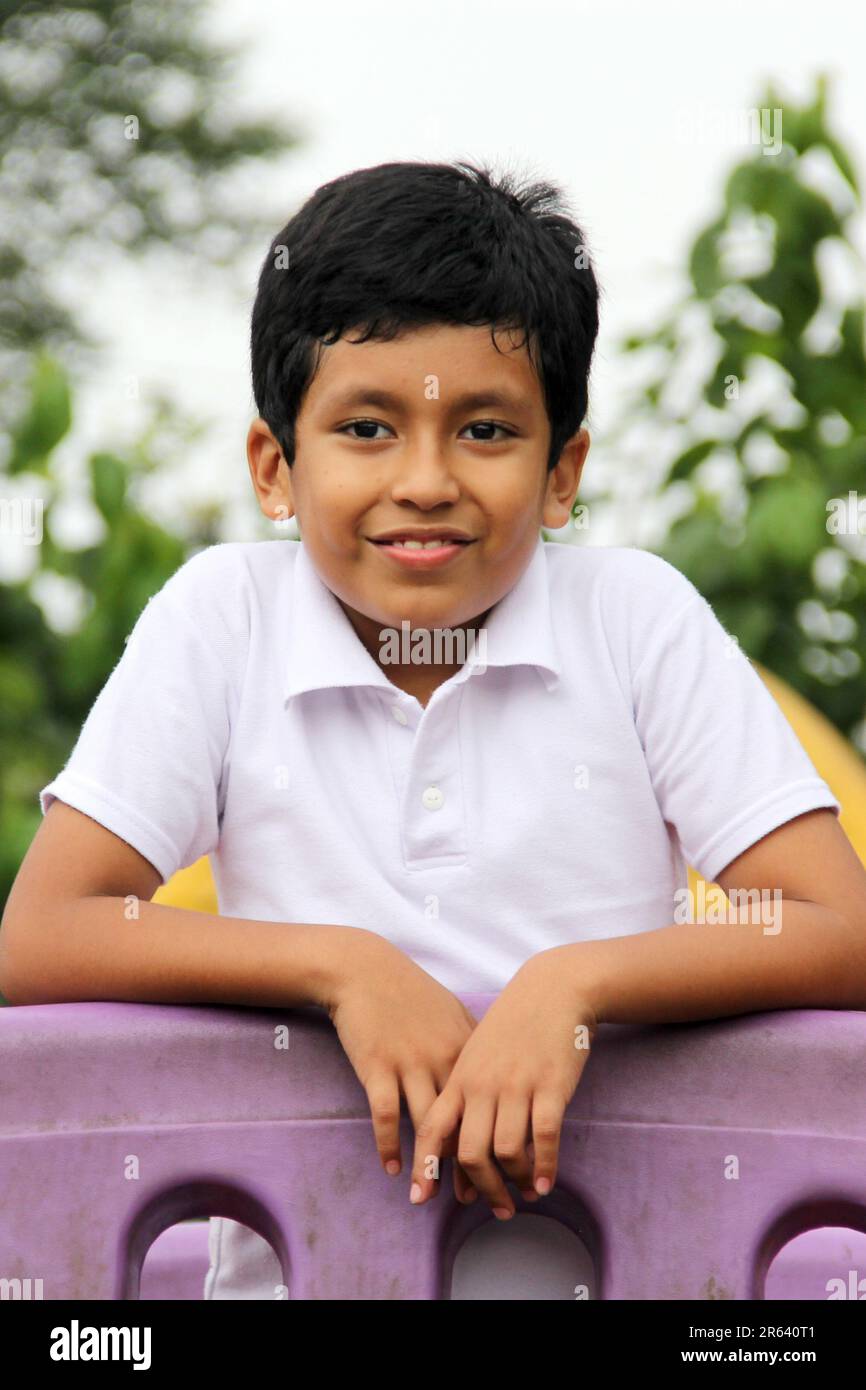 9-year-old Latino brown child boy plays in the park games lives in ...