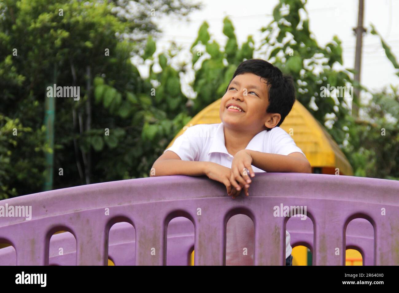 9-year-old Latino brown child boy plays in the park games lives in ...