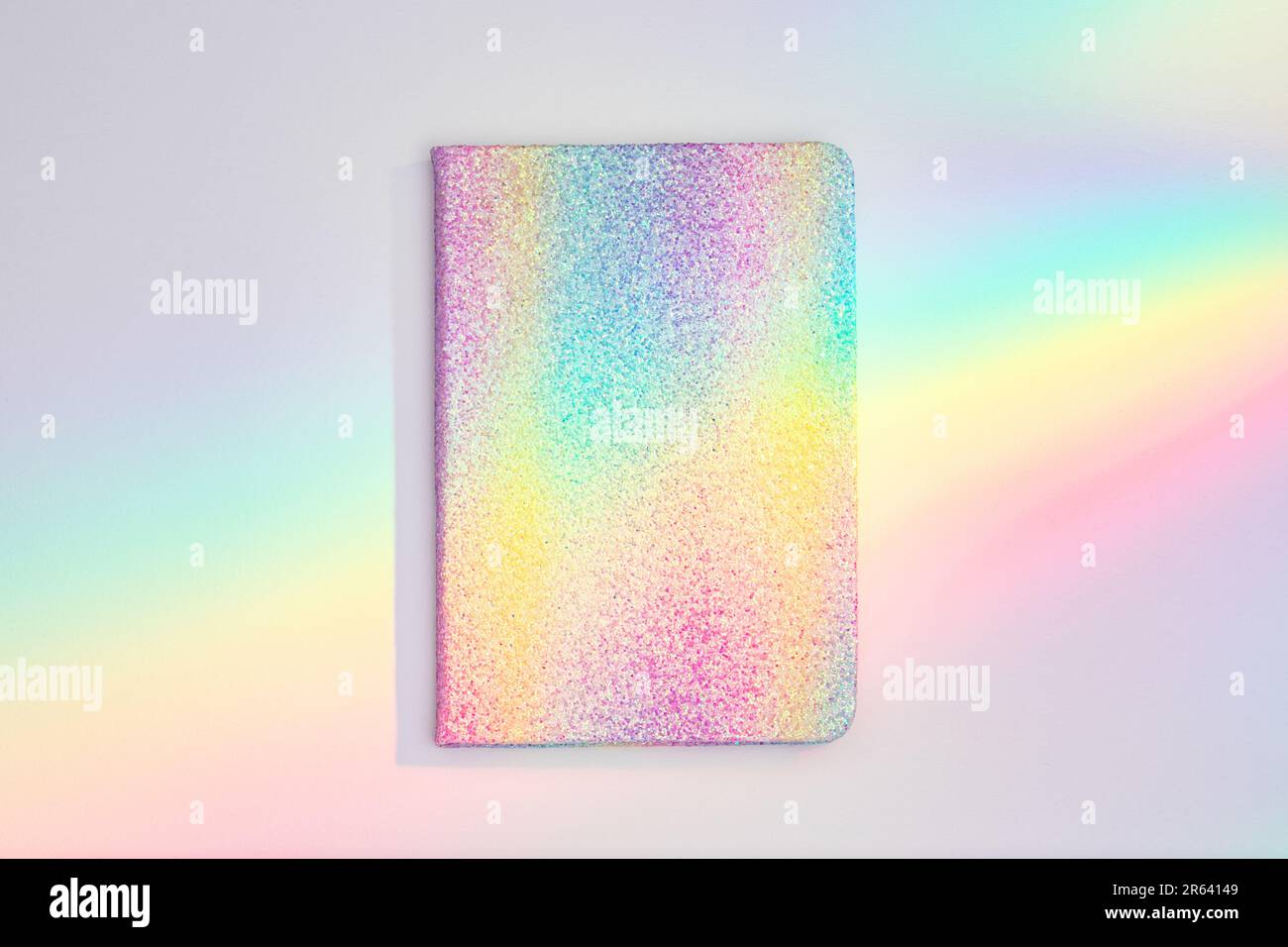 Unicorn colored notepad in rainbow light beam on the desk Stock Photo ...