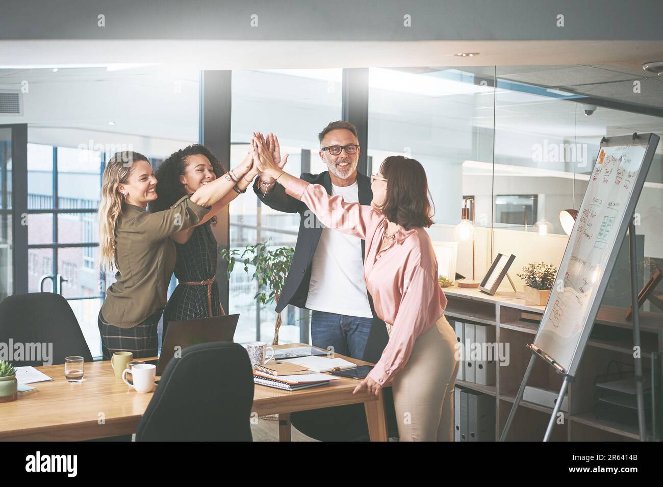 Teamwork gets the work done faster. a diverse group of businesspeople ...