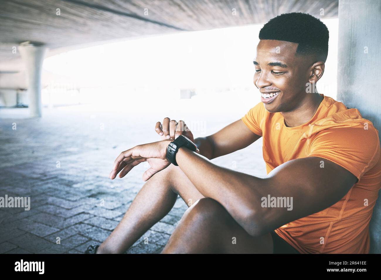 Every tap keeps him in tip top shape. a man looking at his watch during ...