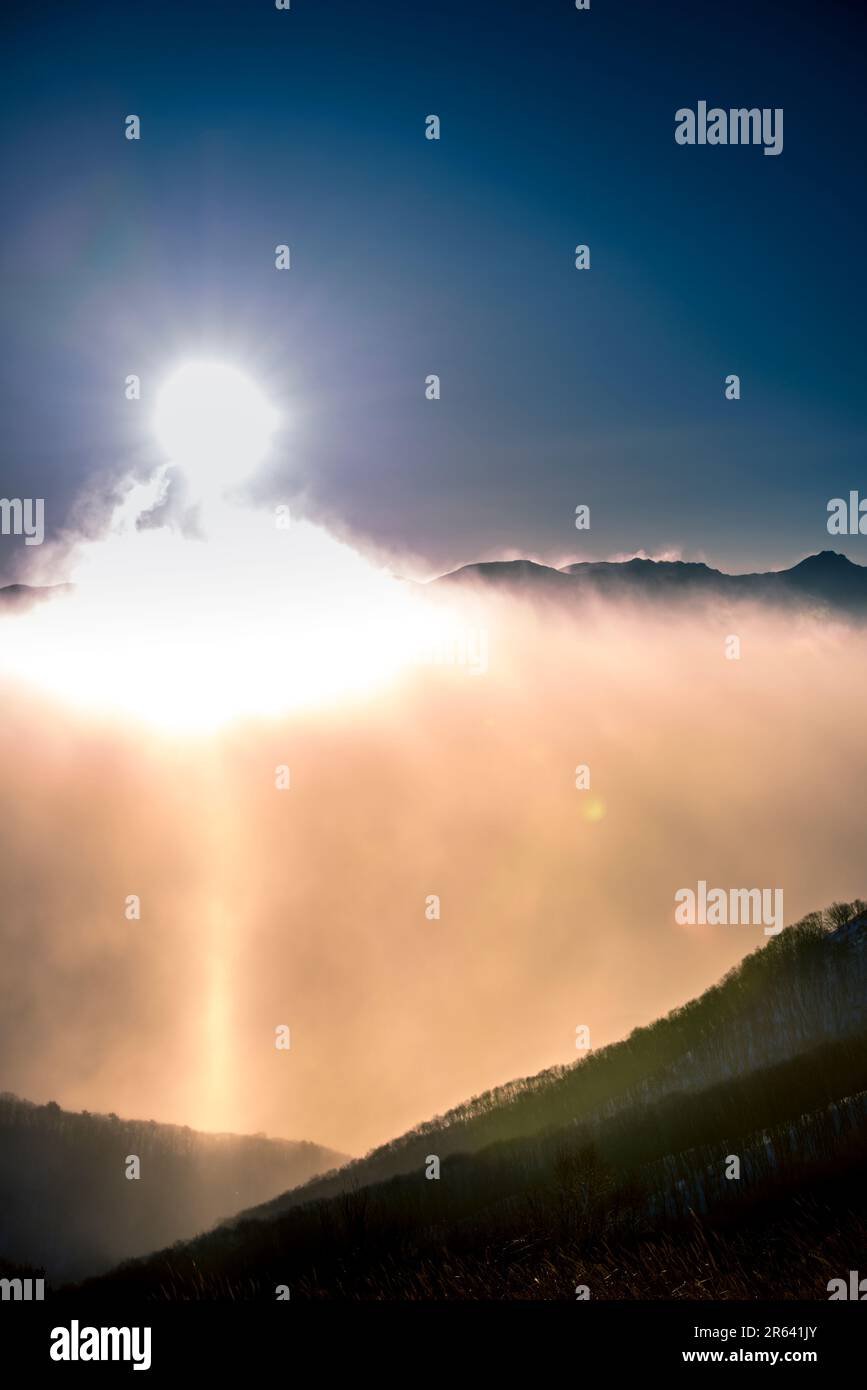 Sun pillar and Yatsugatake mountain range Stock Photo - Alamy