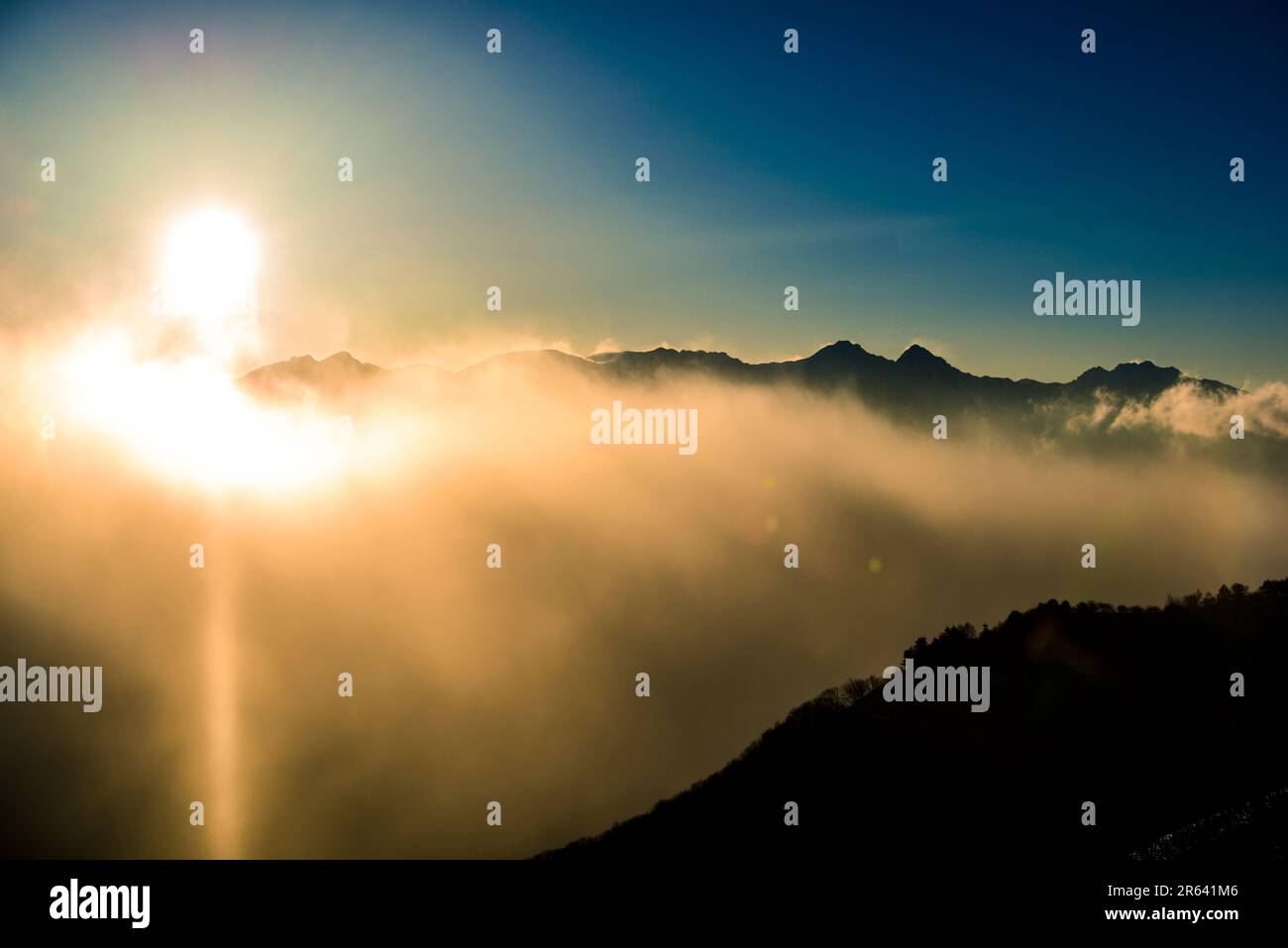 Sun pillar and Yatsugatake mountain range Stock Photo - Alamy