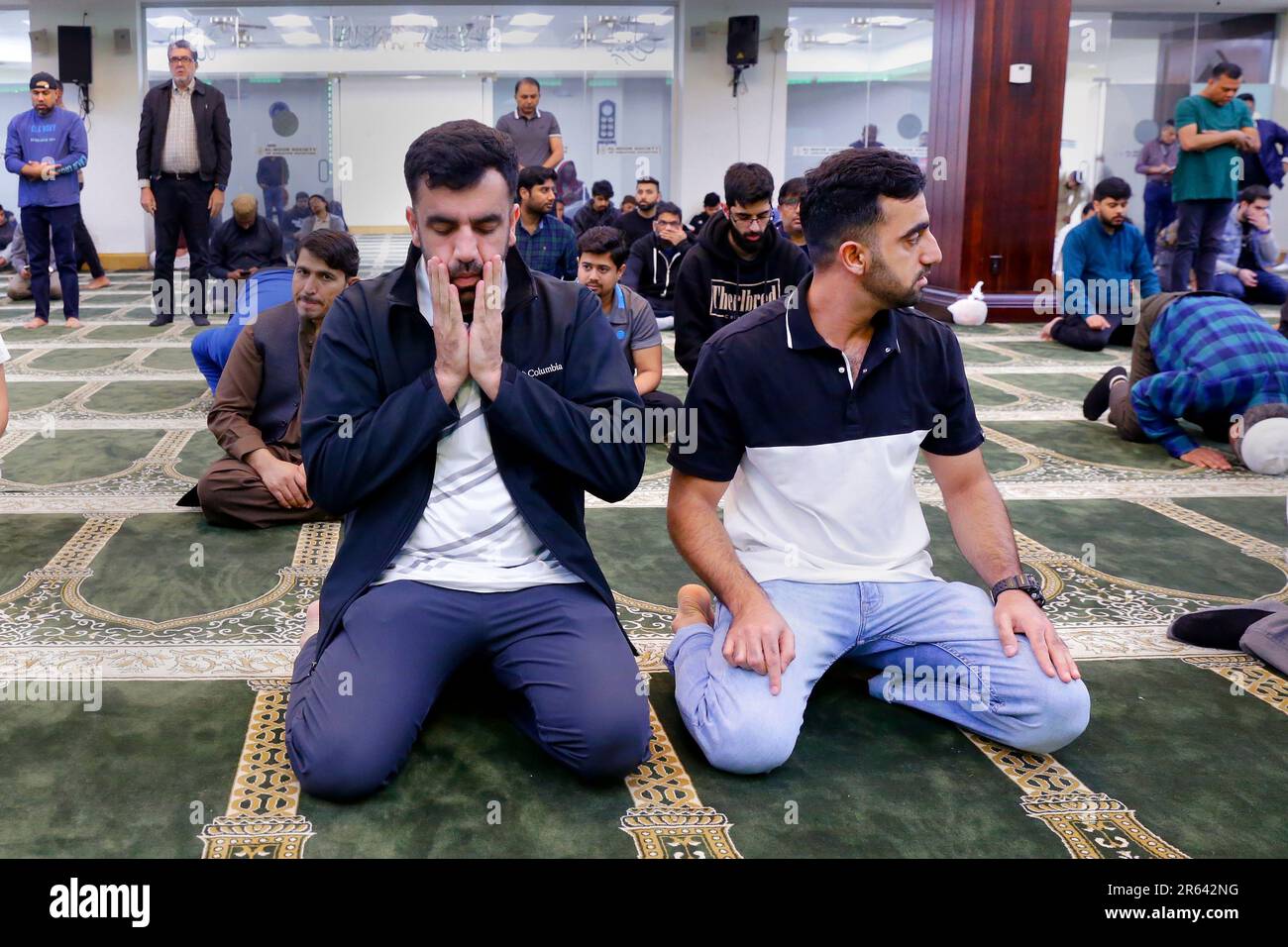 Brothers Samiullah Safi, left, and Abdul Wasi Safi pray during Friday ...