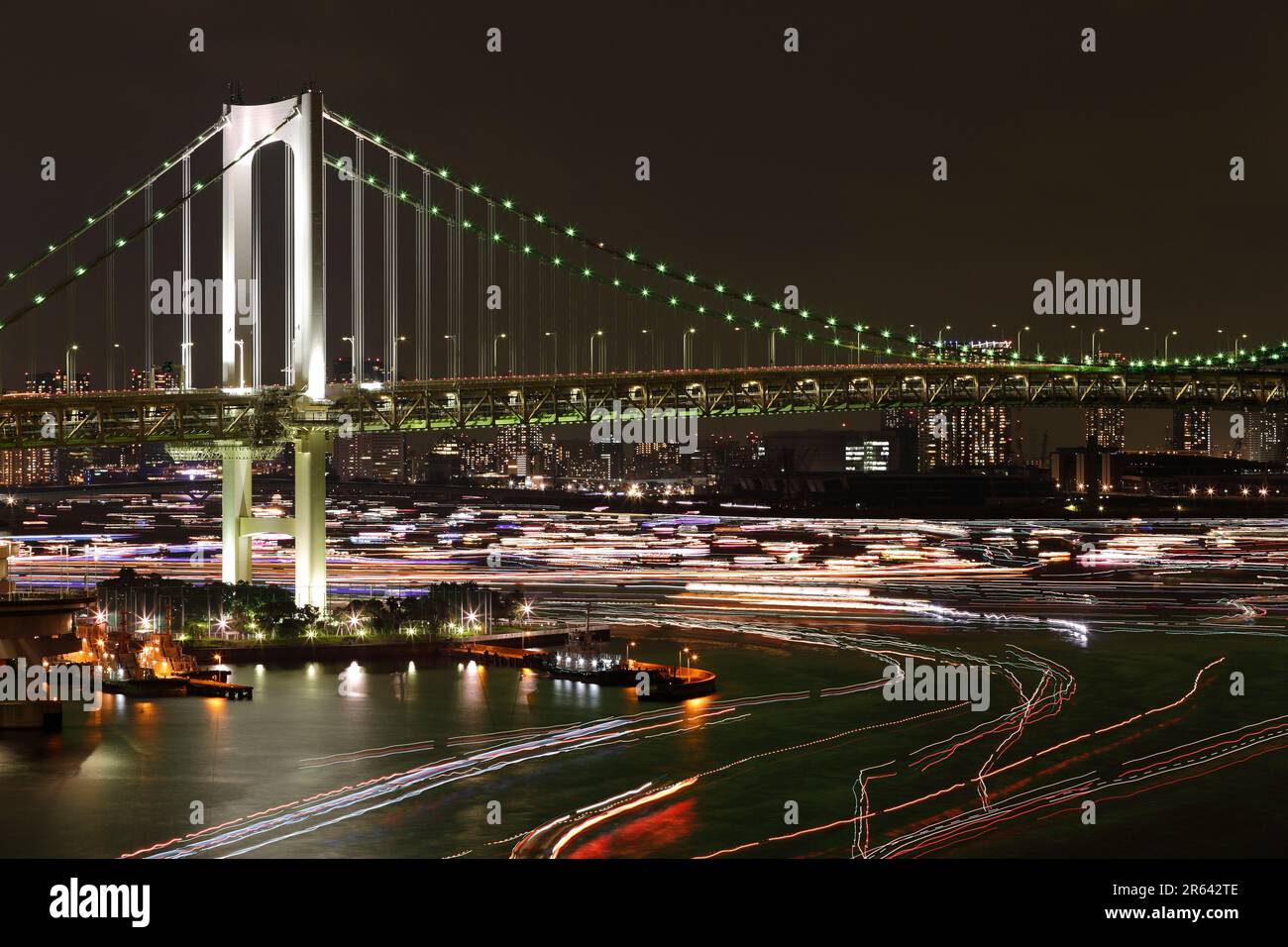 Rainbow Bridge and light trail of houseboat Stock Photo - Alamy
