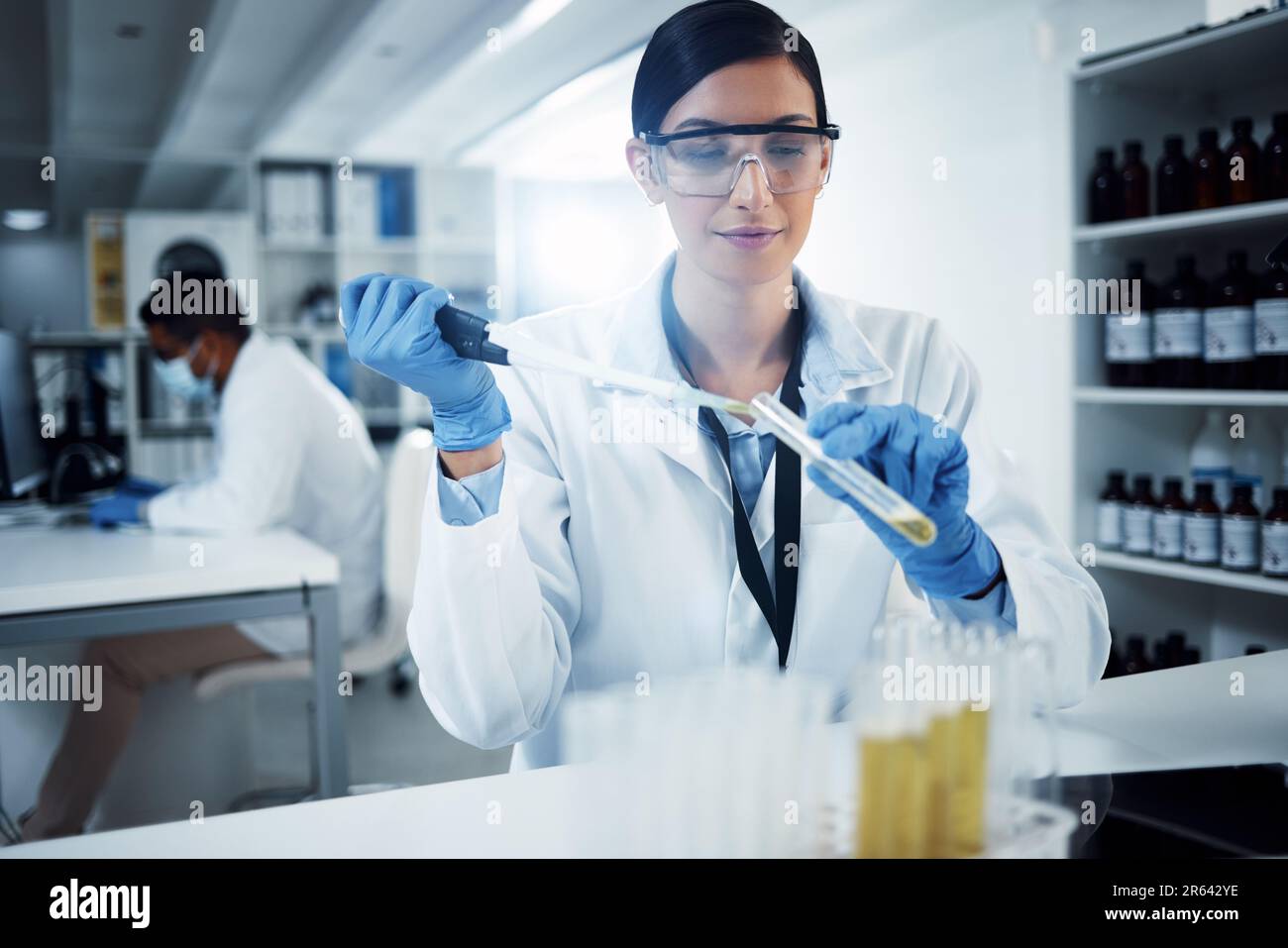 Research, experiment and woman scientist in laboratory with chemical ...