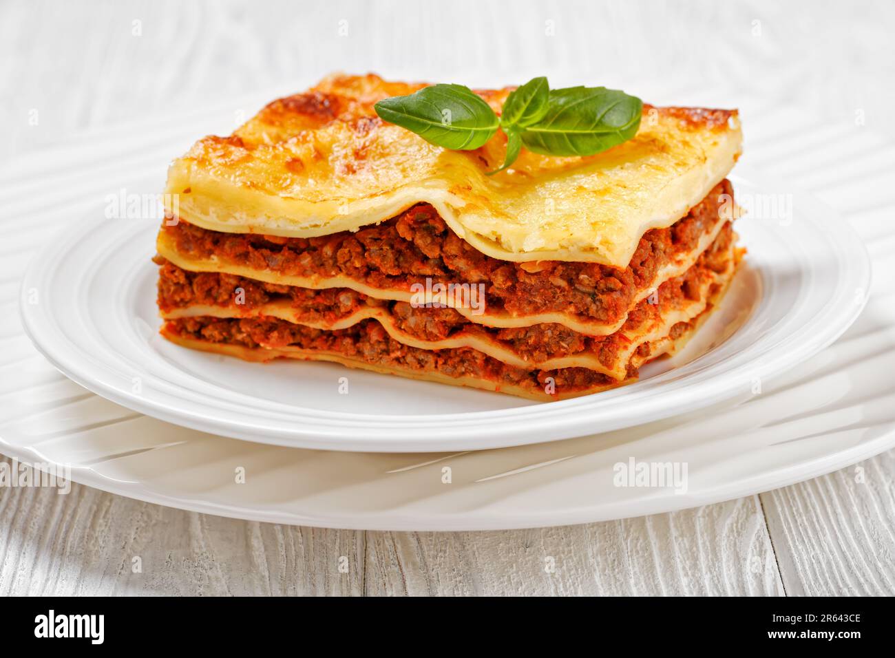 portion of lasagne al forno, italian beef lasagna layered with ground ...