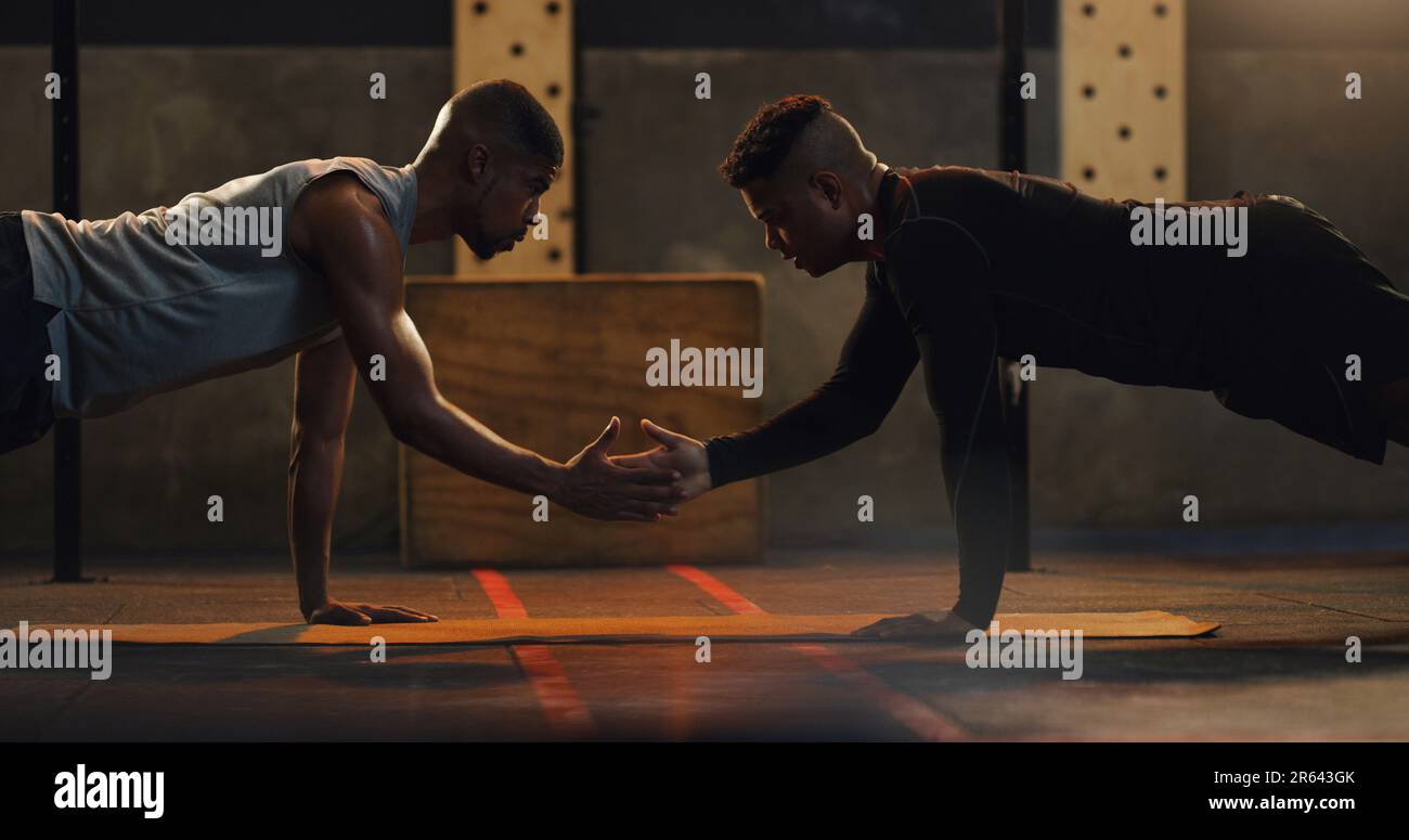 Fitness, high five and men with floor push up at a gym for support ...