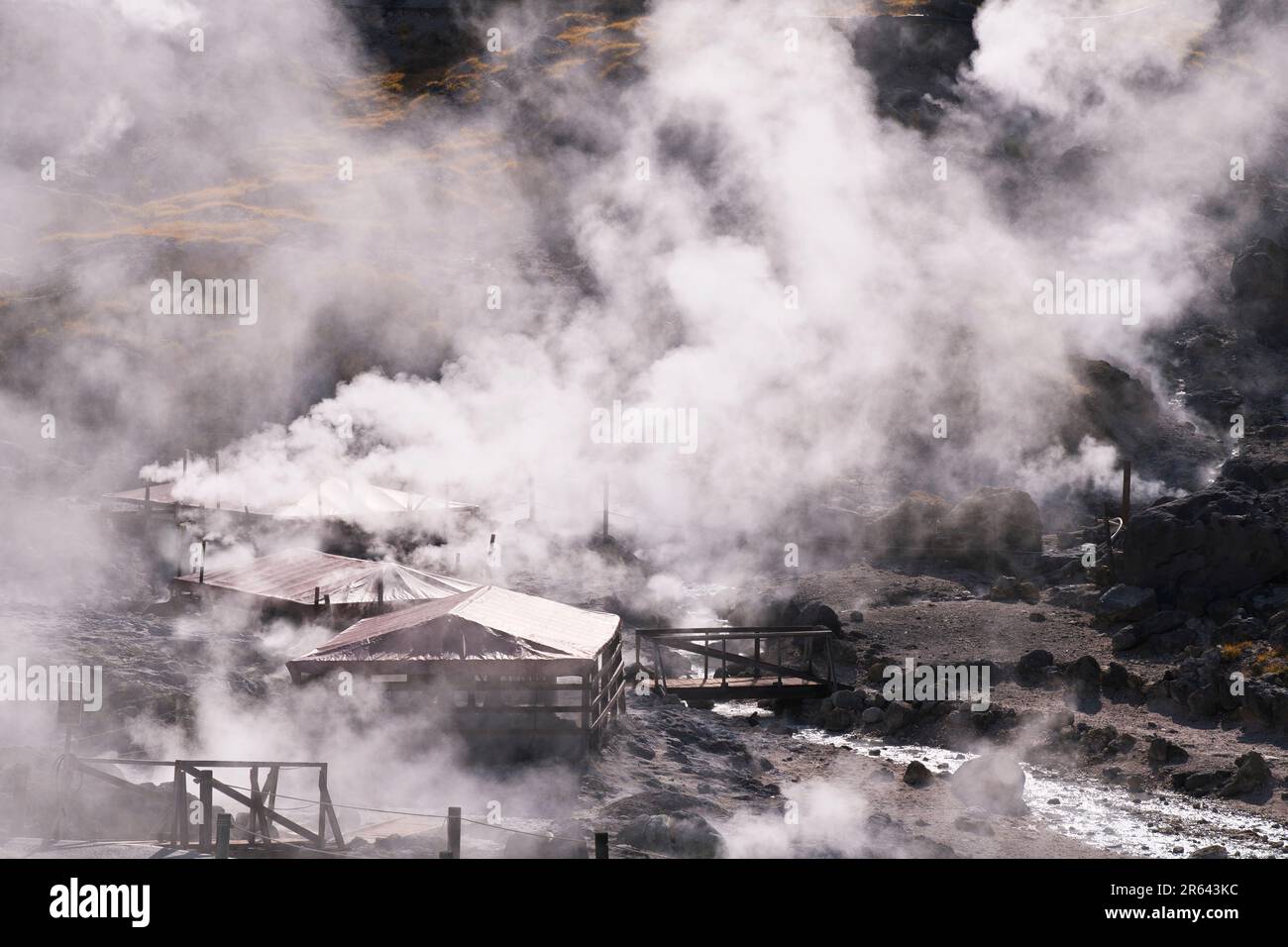 The volcanic fumes of a Tamagawa hot spring and a tent hut Stock Photo ...