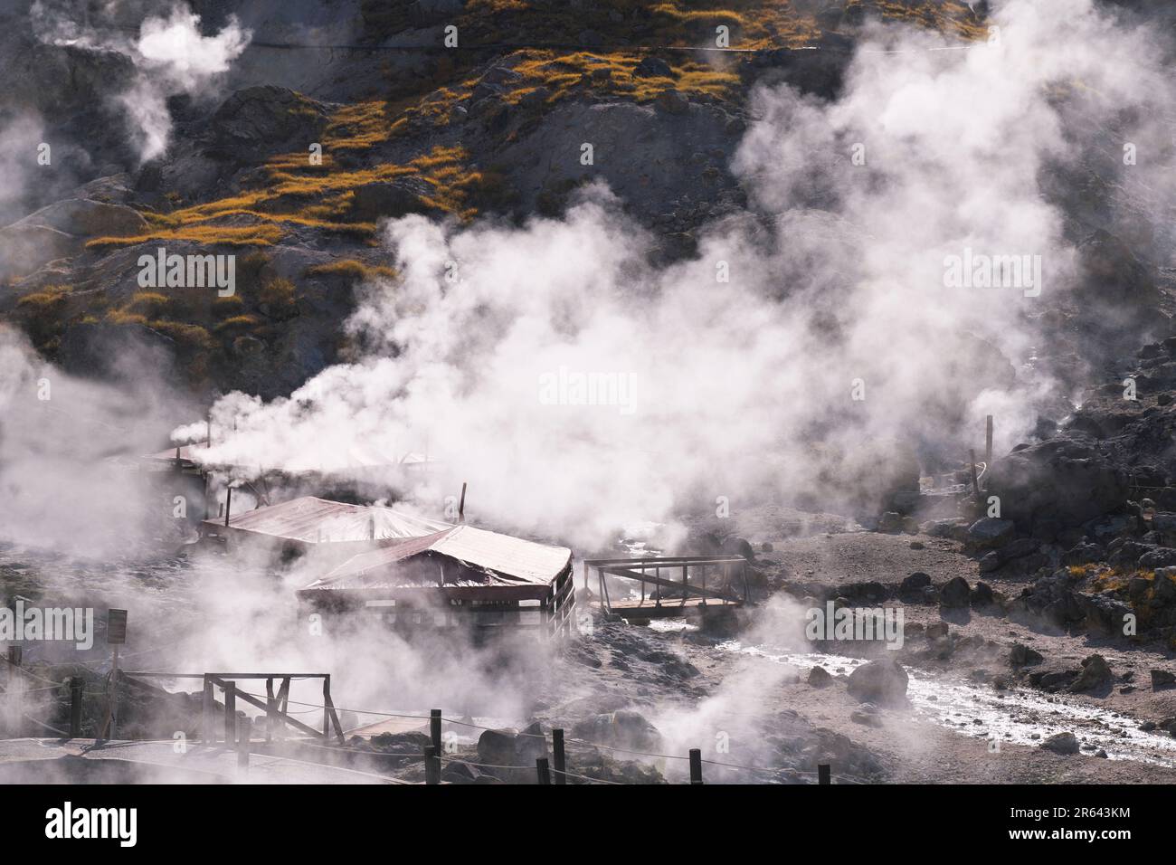 The volcanic fumes of a Tamagawa hot spring and a tent hut Stock Photo ...