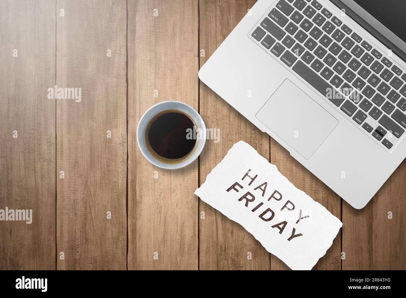 Laptop and coffee cup with a Happy Friday text. Happy Friday concept ...